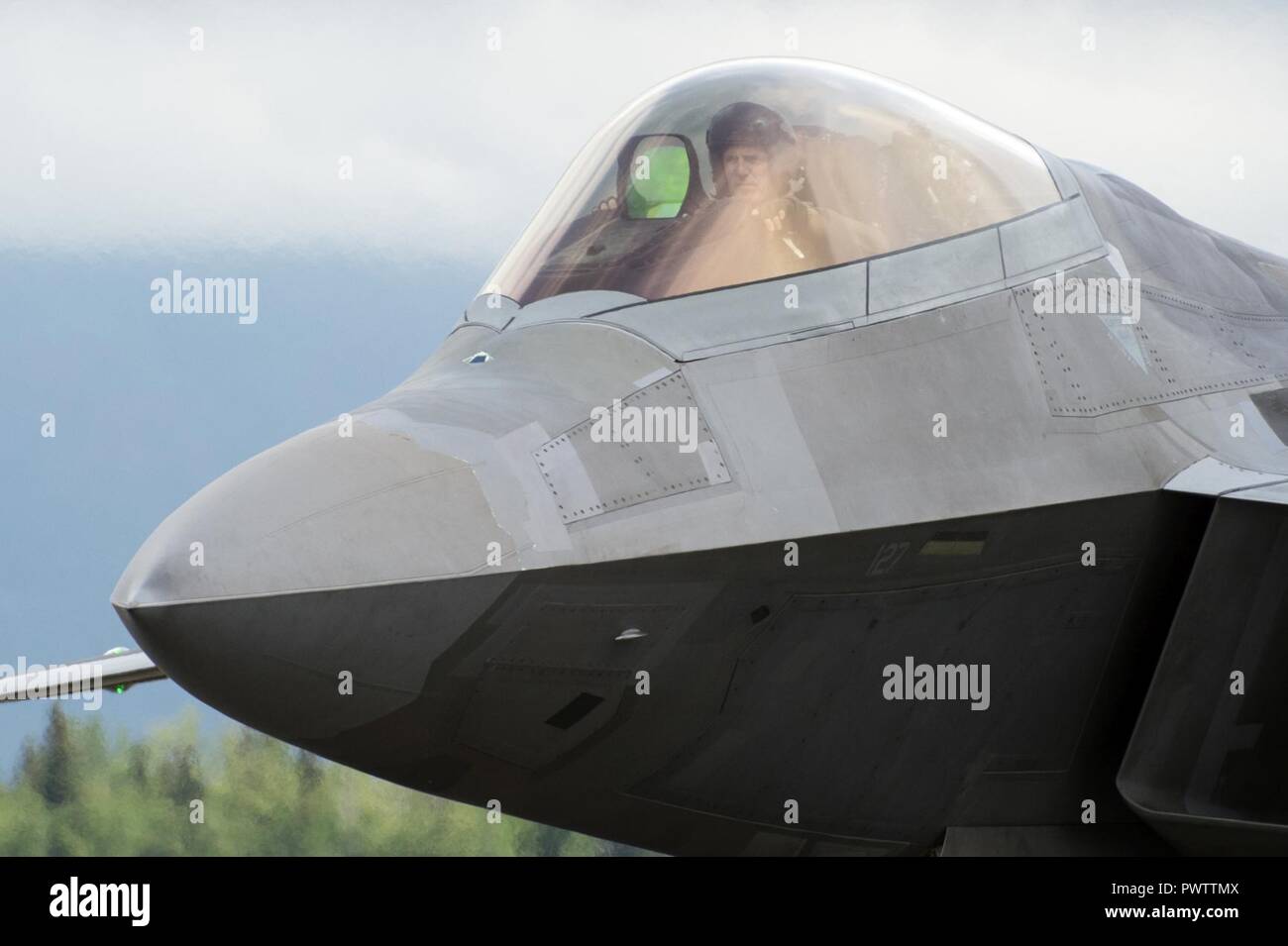 A U.S. Air Force F-22 Raptor pilot, assigned to the 3rd Wing, taxis his ...