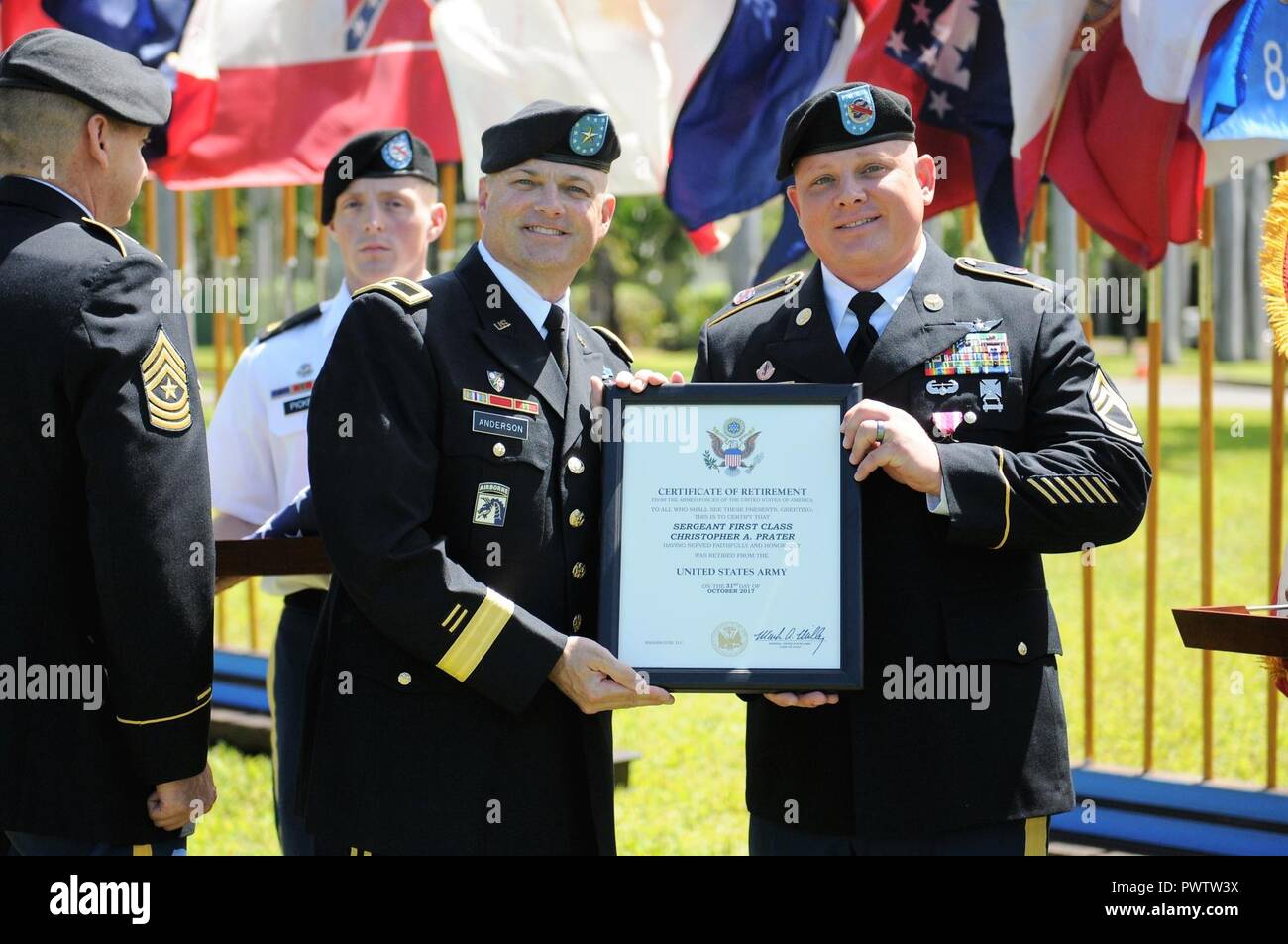 Sgt. 1st Class Christopher A. Prater (right) receives his retirement ...