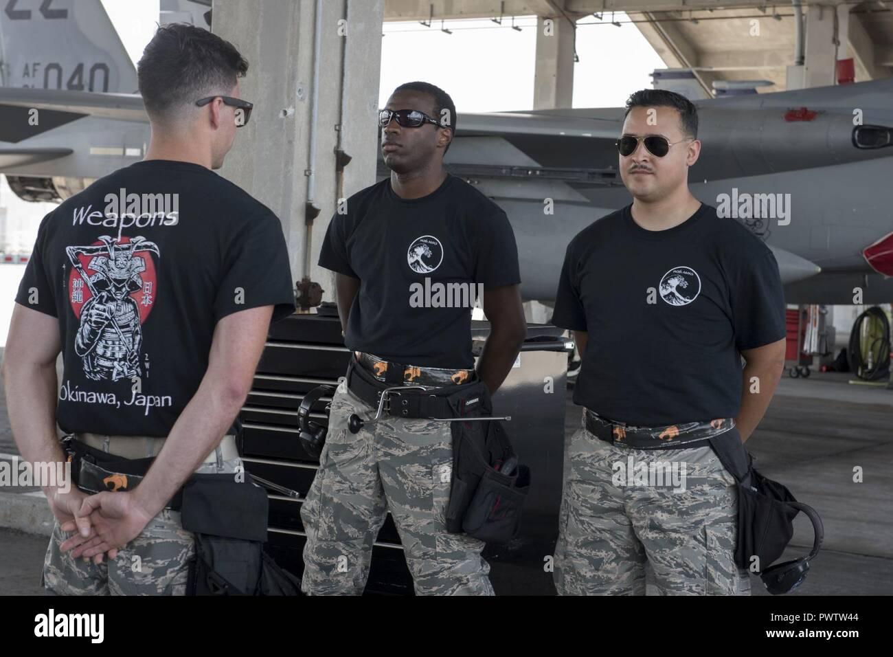 A weapons load team from the 120th Fighter Squadron stands by for their ...