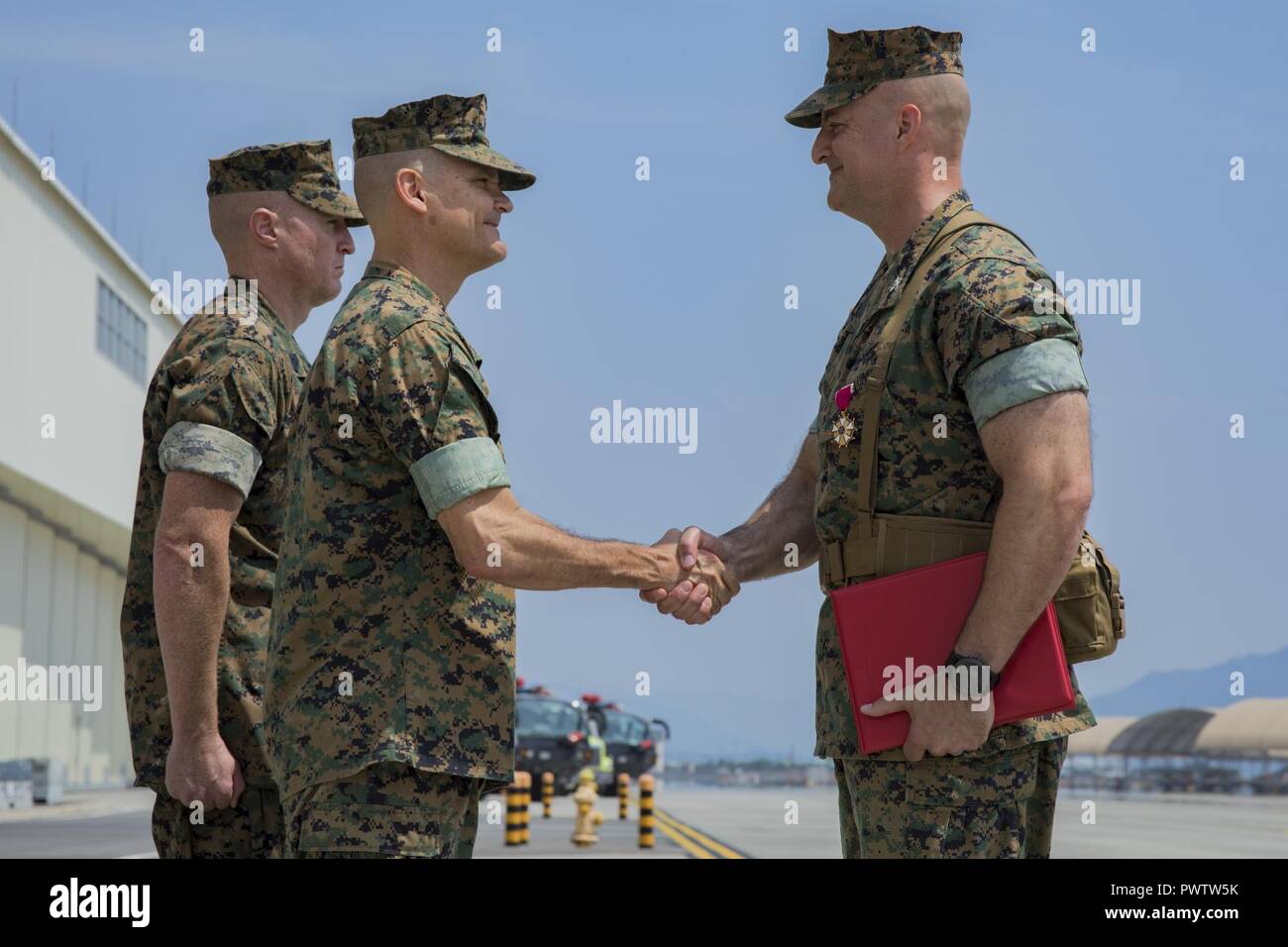 U.S. Marine Corps Maj. Gen. Russell A. Sanborn, left, the commanding general of 1st Marine ...