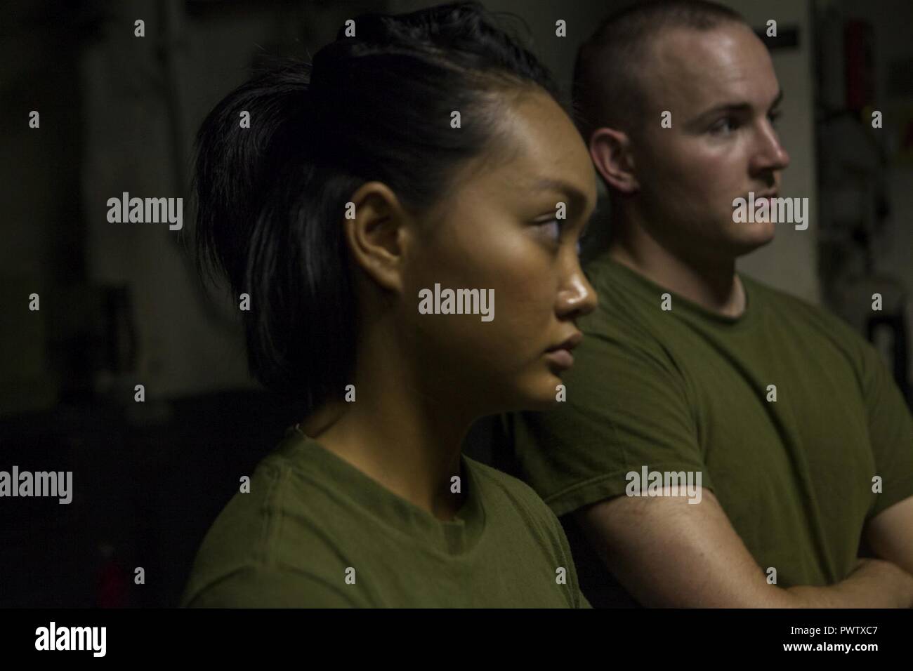 Lance Cpl. Amy Phan (left) and 2nd Lt. Ethan Treacy pay attention to instructions from their ...