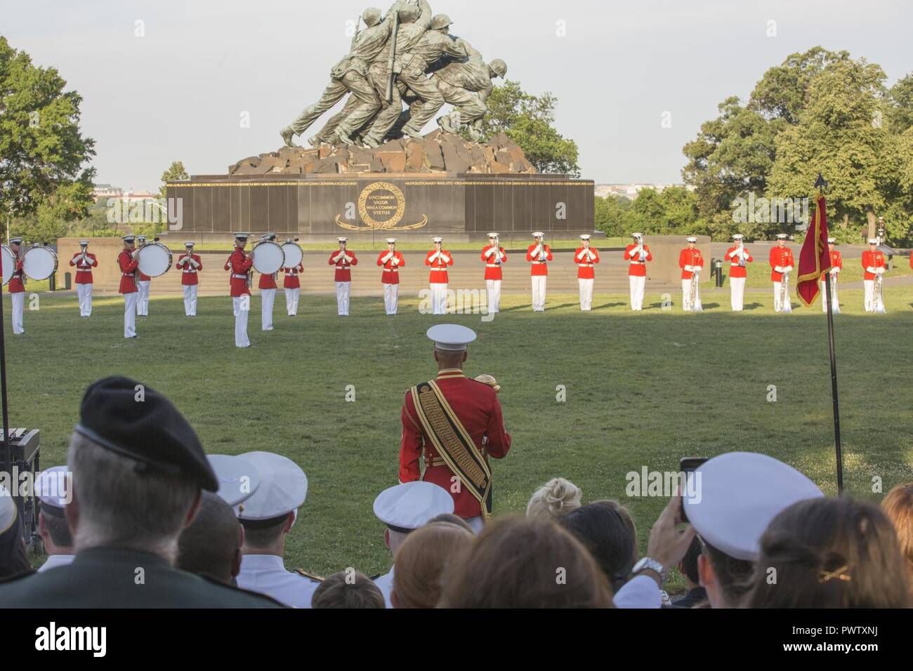 The U.S. Marine Drum and Bugle Corps perform during a sunset parade at ...