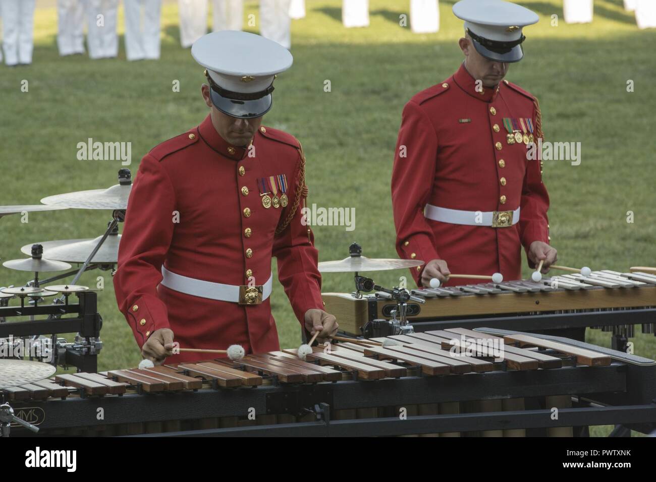 The U.S. Marine Drum and Bugle Corps perform during a sunset parade at ...