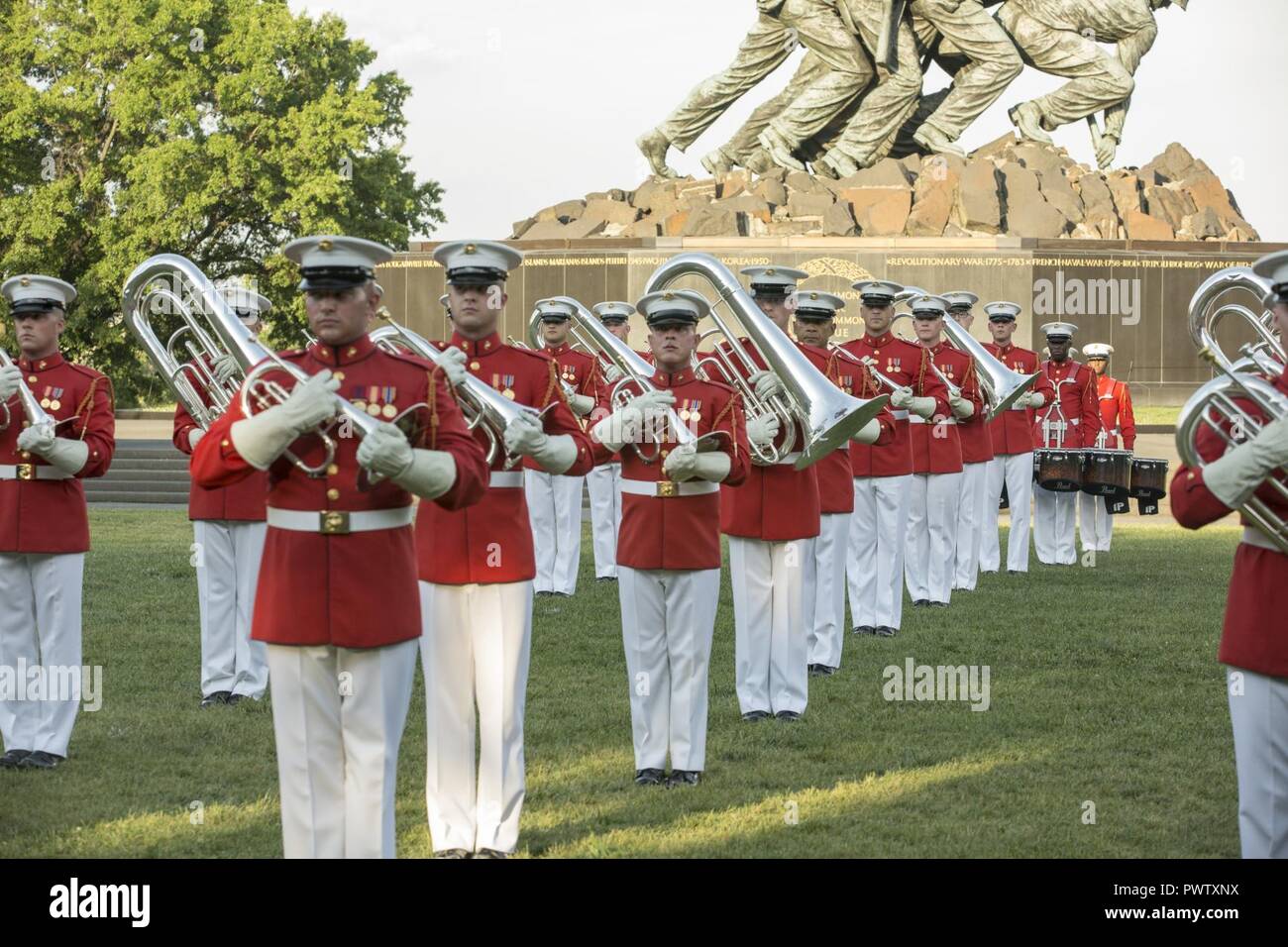 The U.S. Marine Drum and Bugle Corps perform during a sunset parade at ...