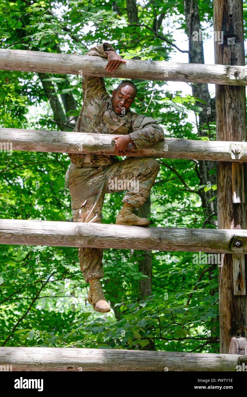 A soldier undertakes the challenge of a vertical climb during the BN ...