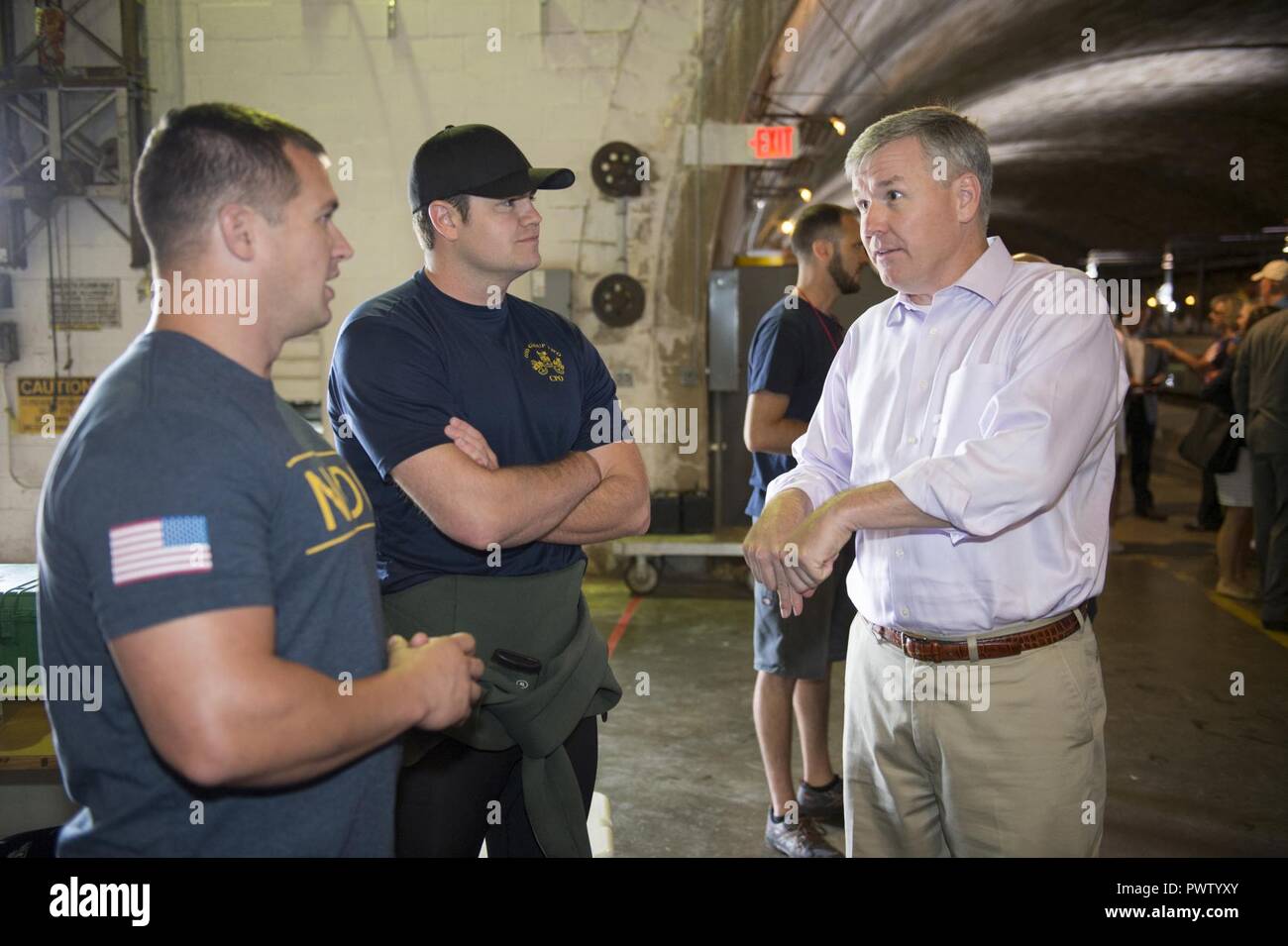 Chief Navy Diver Justin Griffin and Navy Diver 1st Class Stephen Eide ...