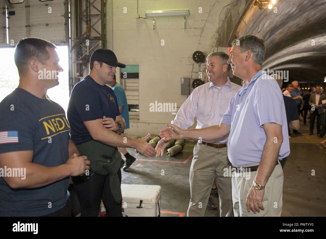 Chief Navy Diver Justin Griffin and Navy Diver 1st Class Stephen Eide ...