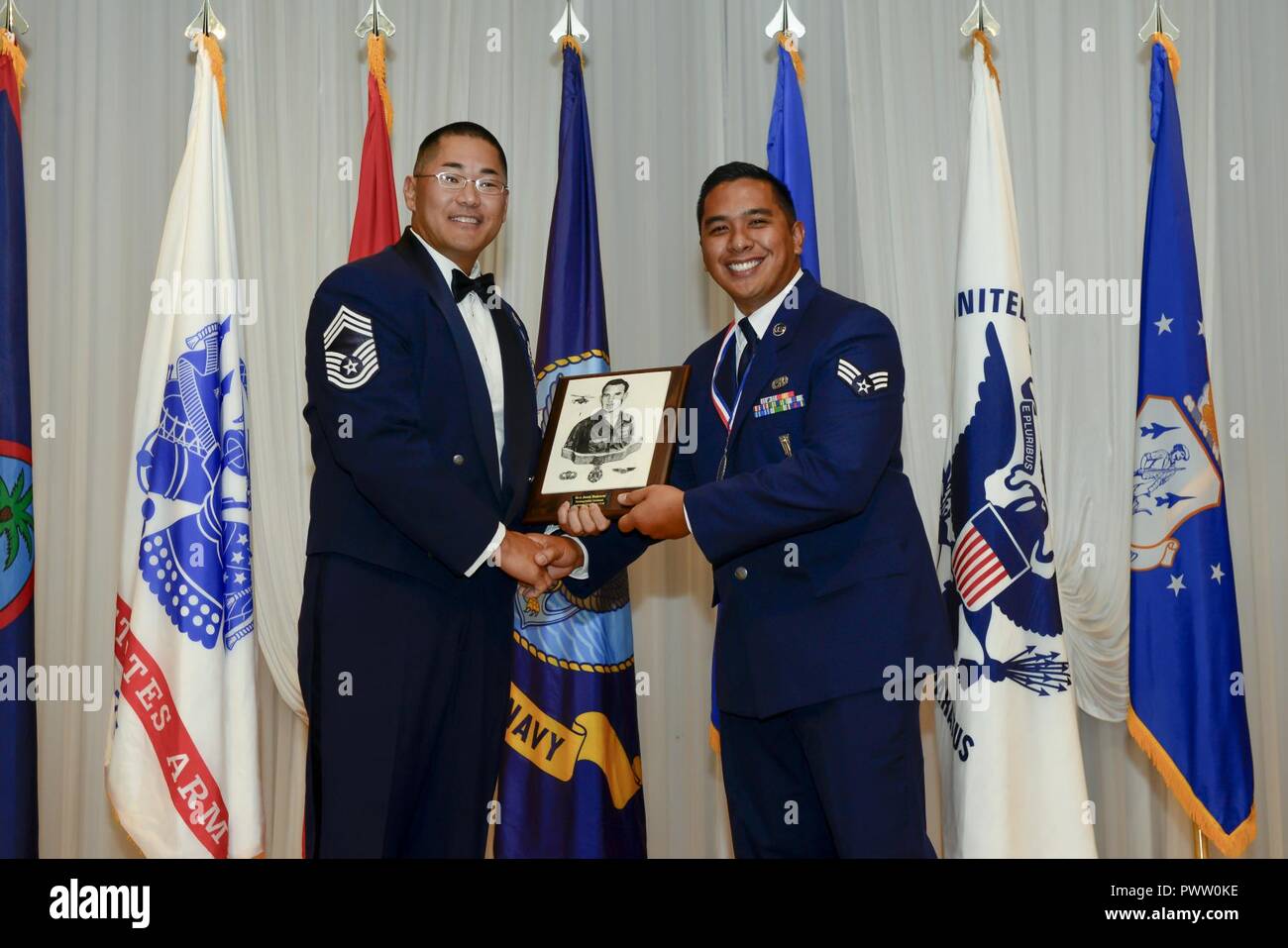U.S. Air Force Senior Airman Jesus Babauta receives a distinguished ...