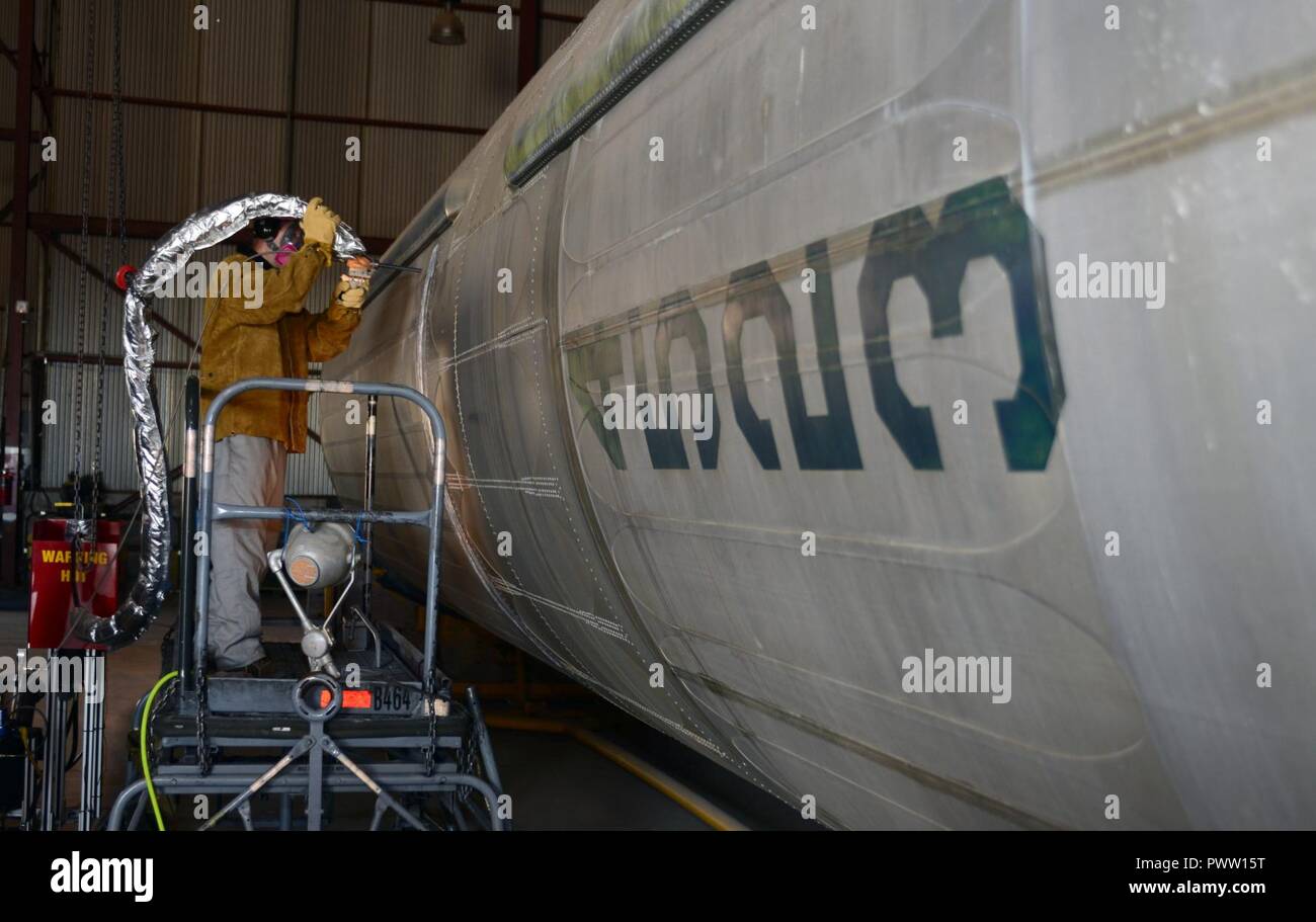 Dustin Blosmo, the chief engineer with VRC Metal Systems, repairs the ...