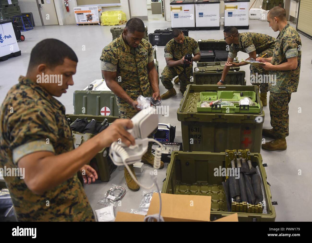 U.S. Marine Corps and U.S. Navy personnel from the Combat Logistics ...