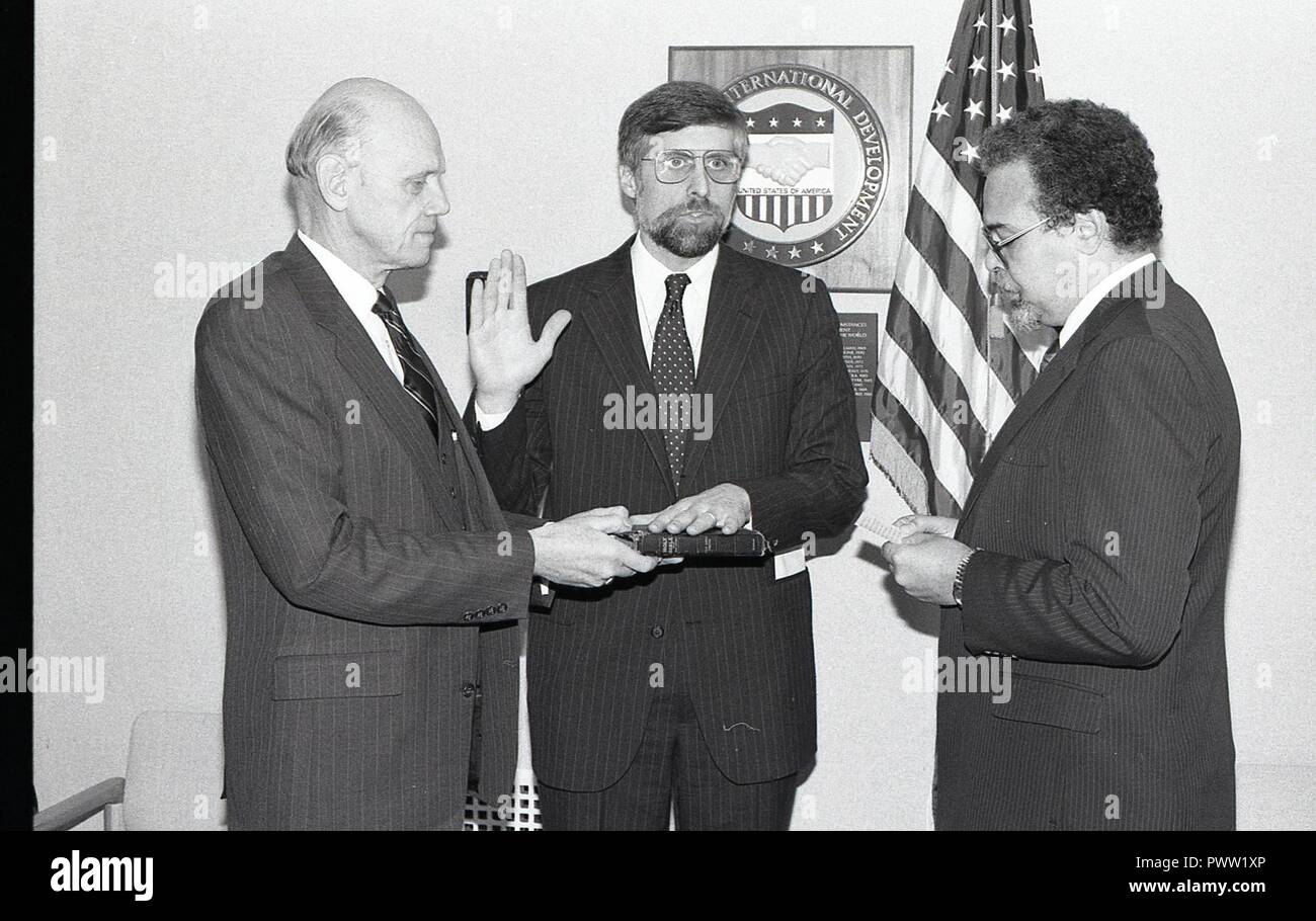 THERE ARE THREE MEN WHICH ONE OF THEM IS TAKING A OATH Stock Photo - Alamy