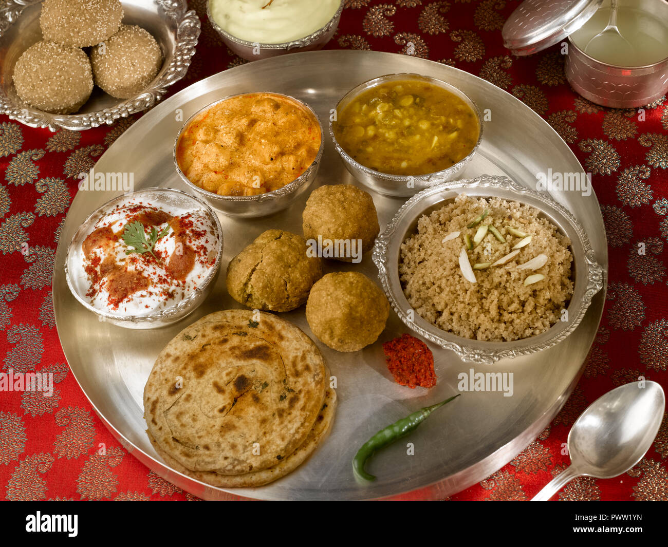 A FULL TRADITIONAL RAJASTHANI MEAL/ RAJASTHANI THALI: LEFT TO RIGHT ...