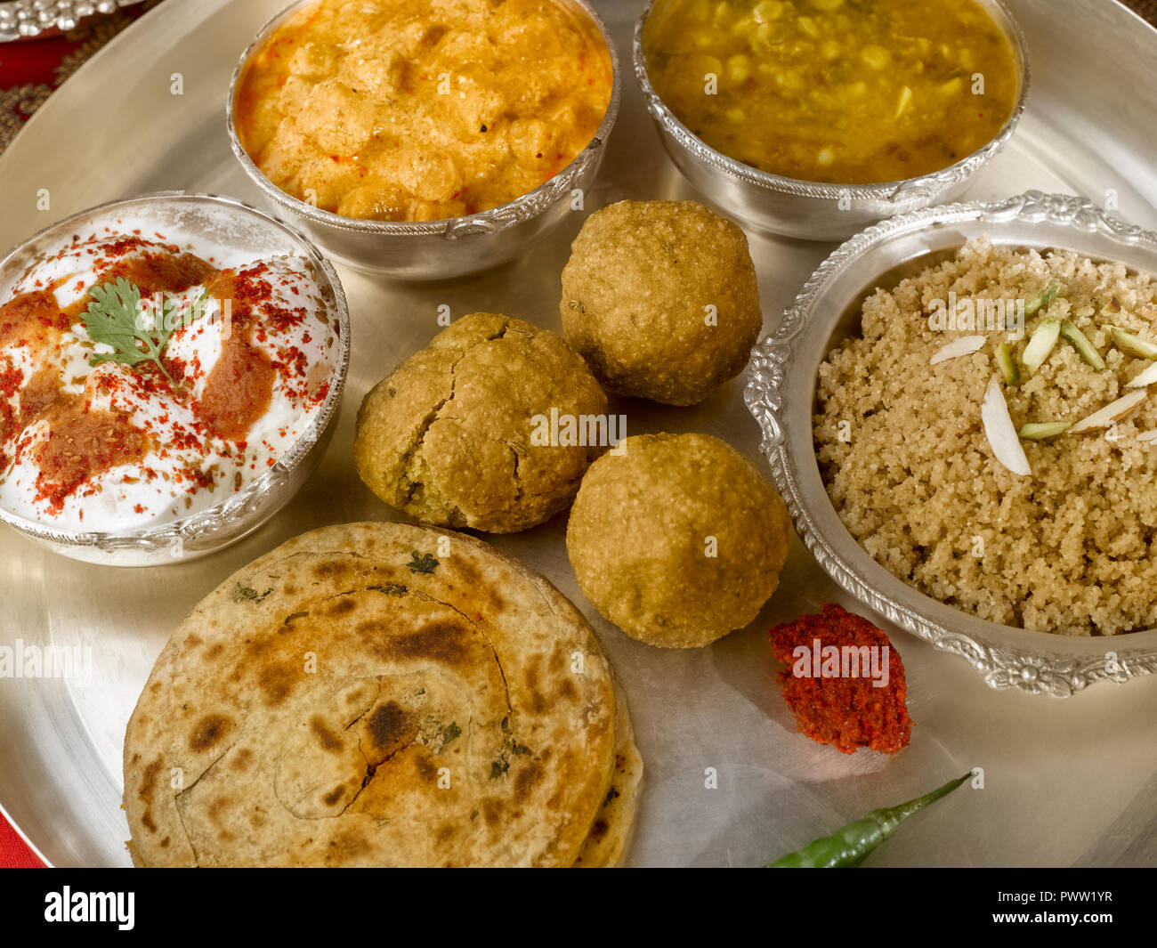 A FULL TRADITIONAL RAJASTHANI MEAL/ RAJASTHANI THALI: LEFT TO RIGHT ...