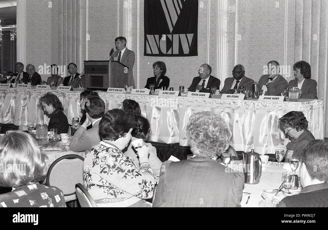 YOU HAVE A MAN AT THE PODIUM GIVING HIS SPEECH TO A GROUP OF MEN AND ...