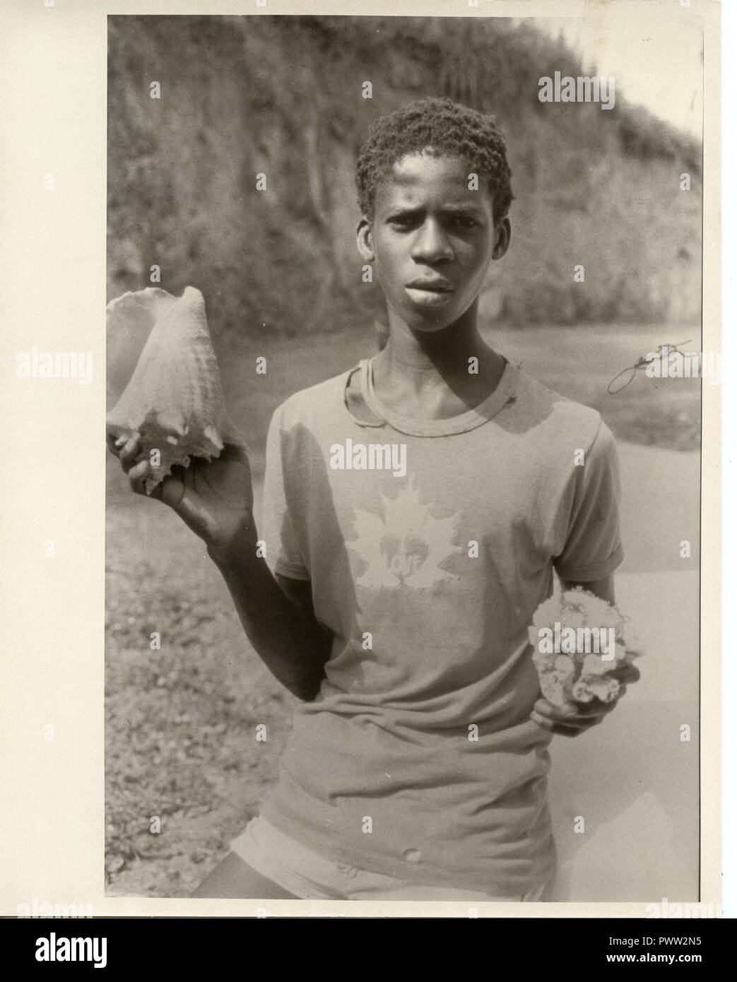 A photo of a boy holding objects in both hands Stock Photo - Alamy