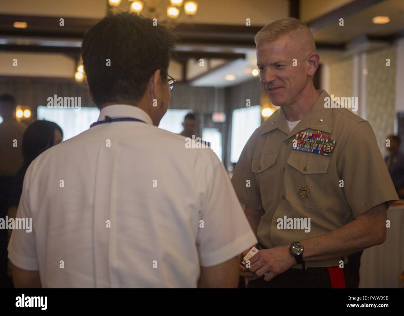 U.S. Marine Corps Brig. Gen. Paul Rock speaks to guest at a change of ...