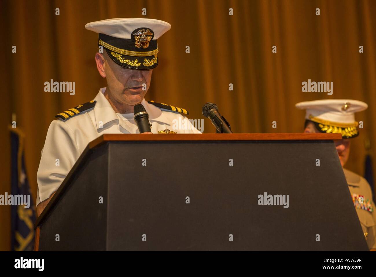 U.S. Navy Cmdr. John M. Hakanson, chaplain, gives an invocation for the ...