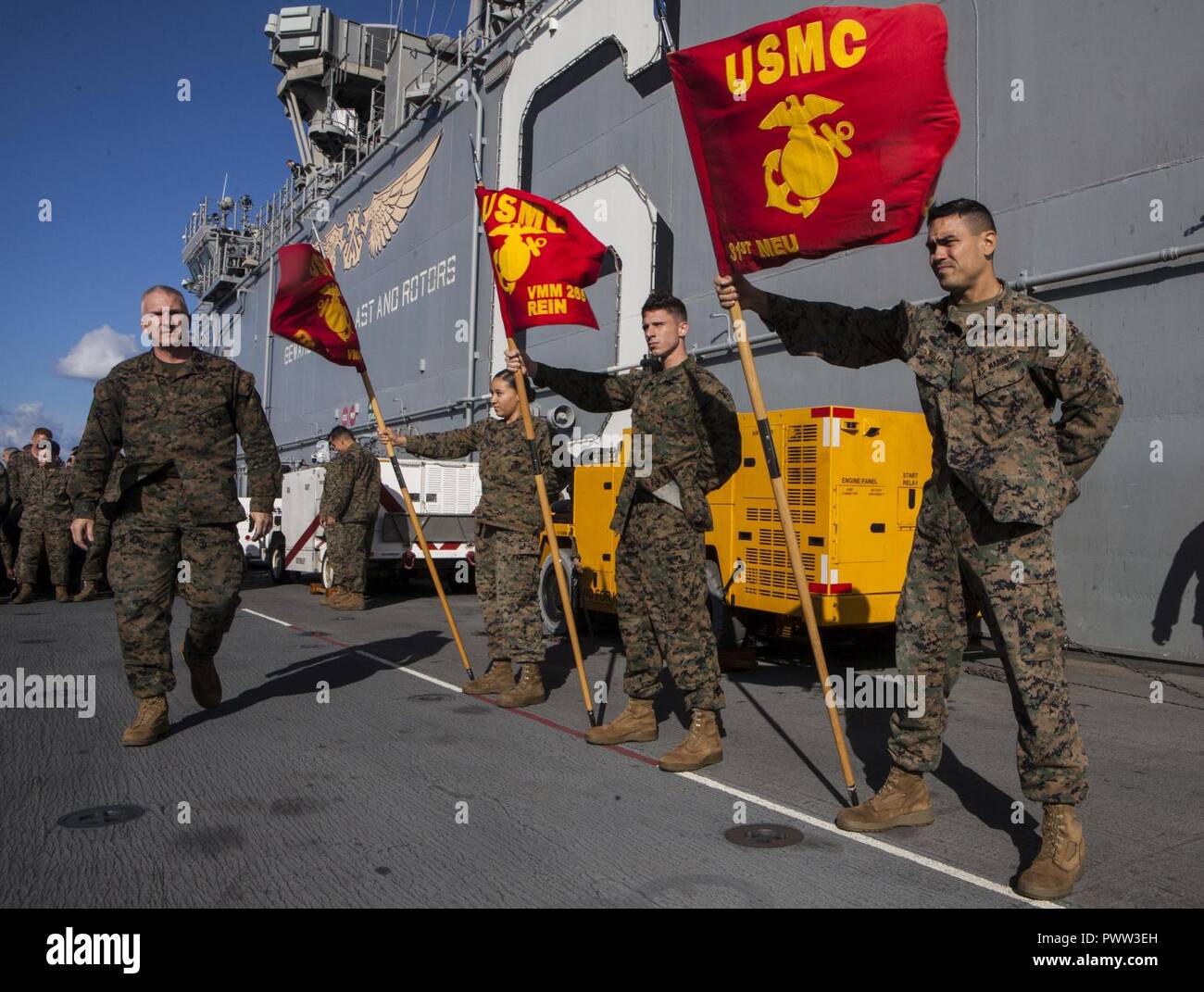Marines with the 31st Marine Corps Expeditionary Unit hold guidons ...