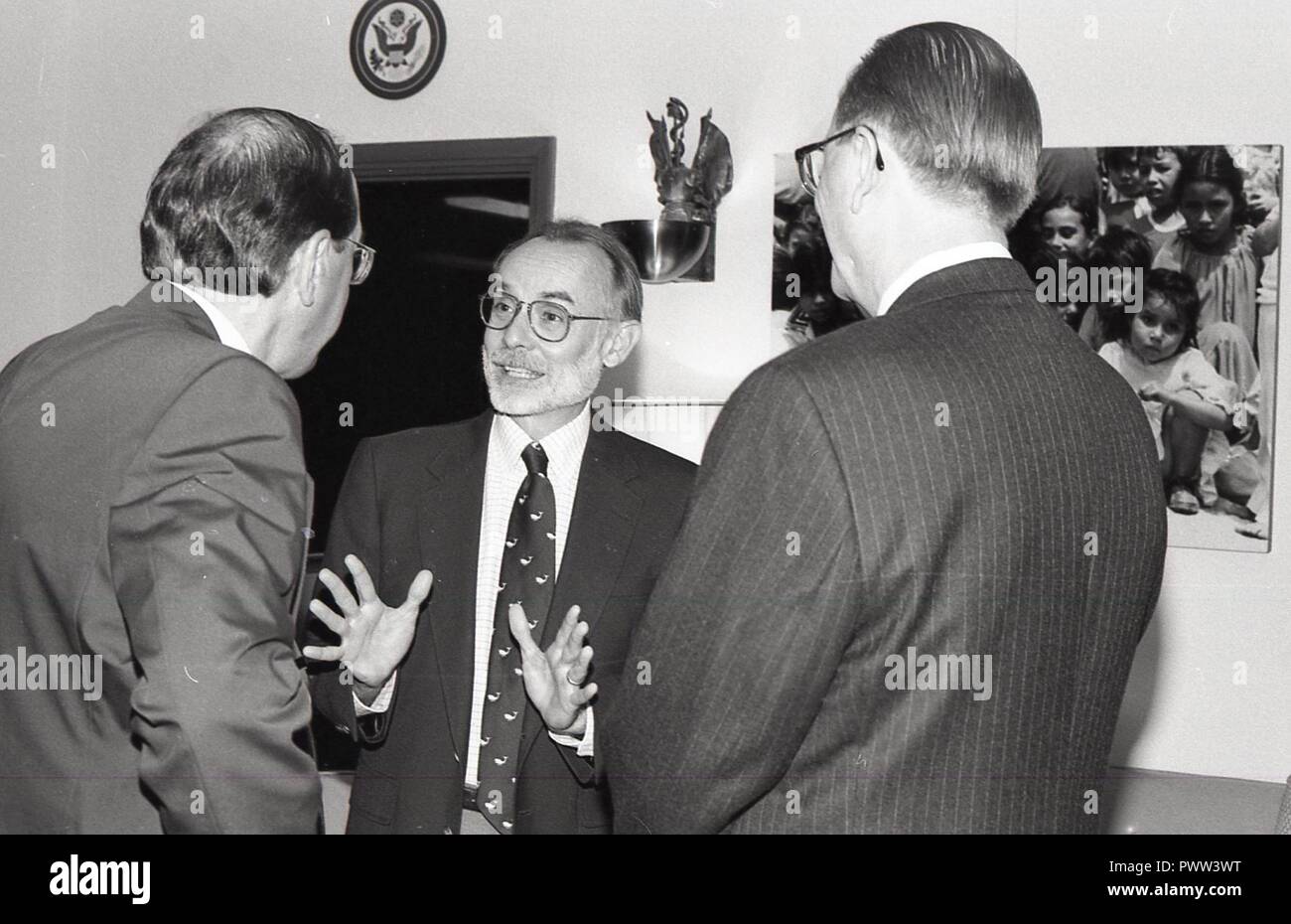 Group of men talking to each other Stock Photo - Alamy