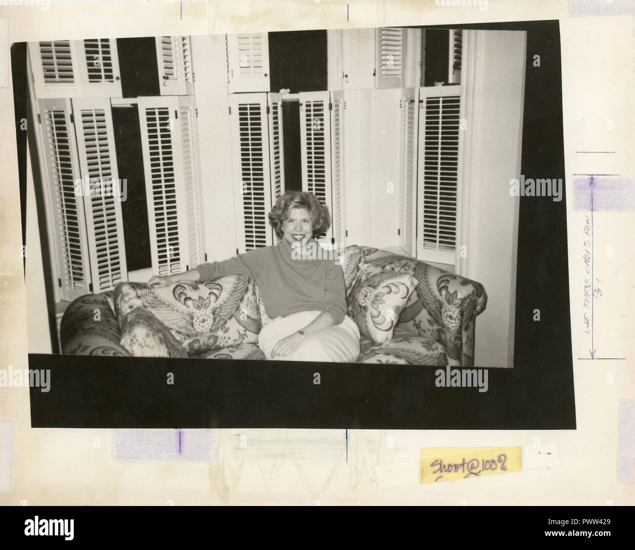 BARBARA UPTON IS SMILING SITTING ON HER SOFA Stock Photo - Alamy