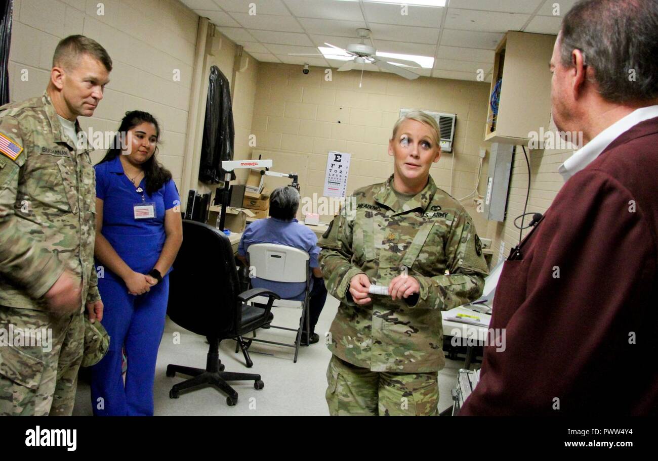 Maj. Jennifer Meadows (2nd from right), an optometrist and an Army ...