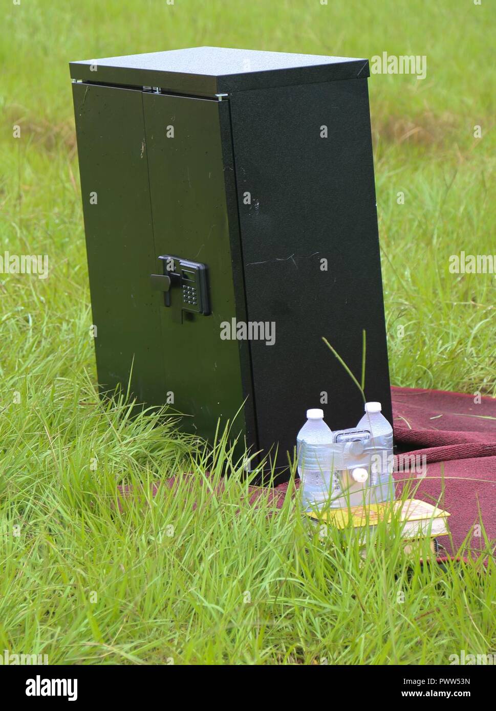 A Stingray Fluid Blade Disruptor positioned to open a safe containing ...