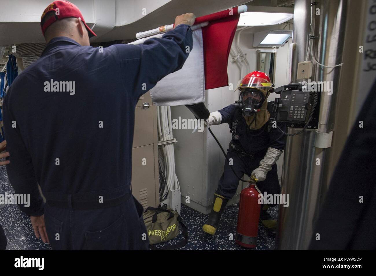 PACIFIC OCEAN (June 26, 2017) A repair locker investigator uses a ...