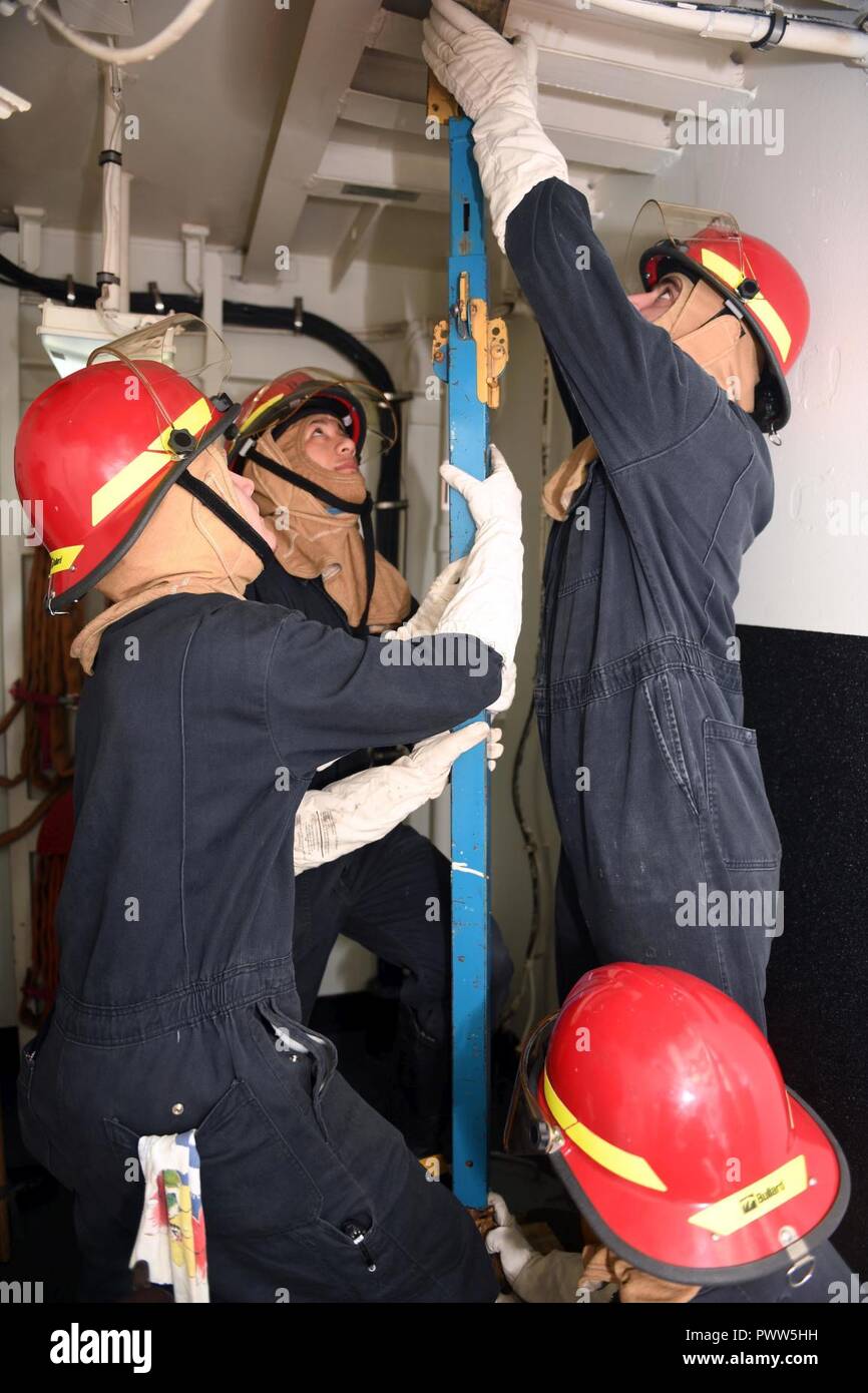 U.S. 5TH FLEET AREA OF OPERATIONS (June 27, 2017) Sailors set shoring ...