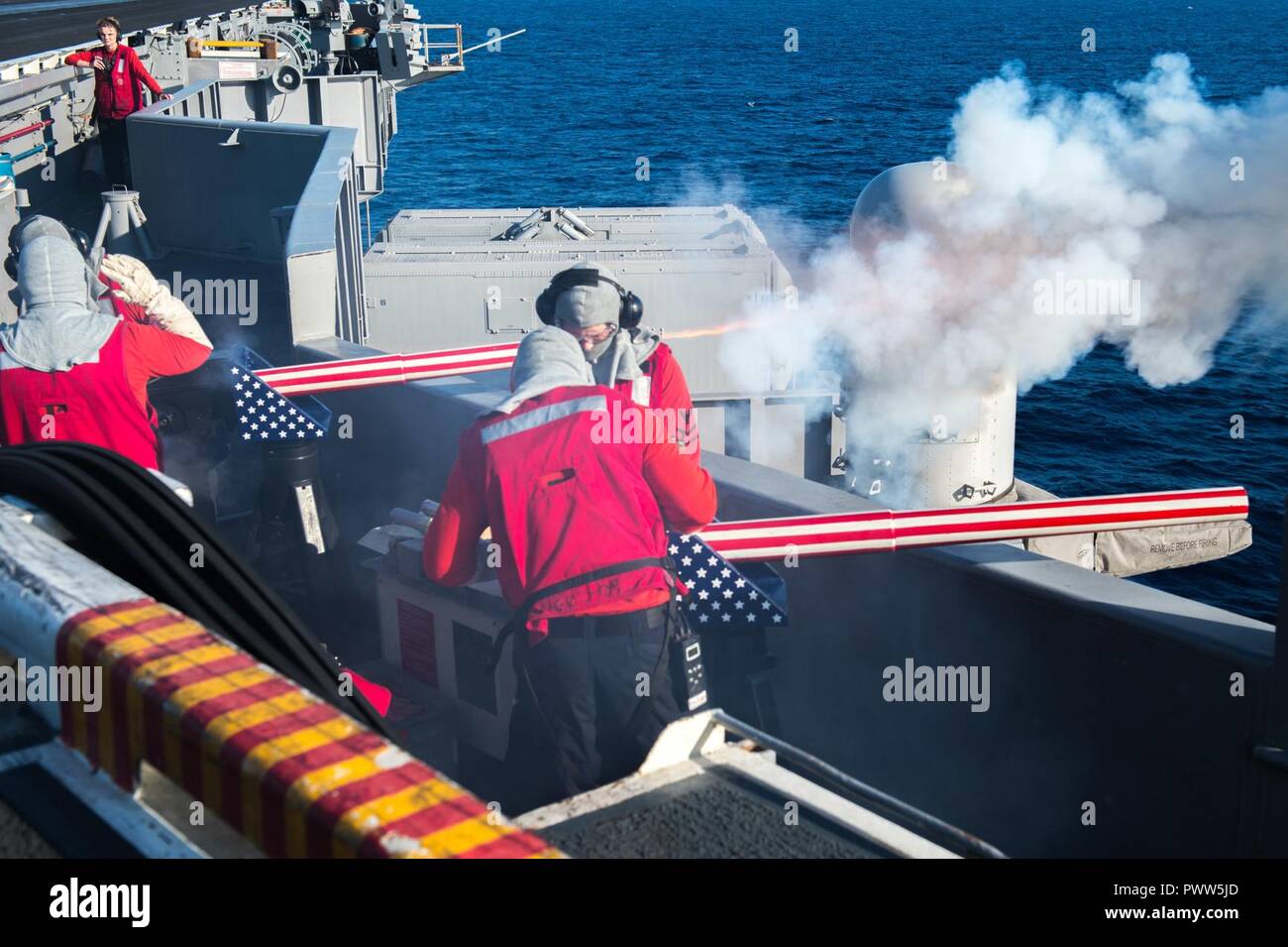 PACIFIC OCEAN (June 26, 2017) - Sailors fire a 40mm saluting cannon ...