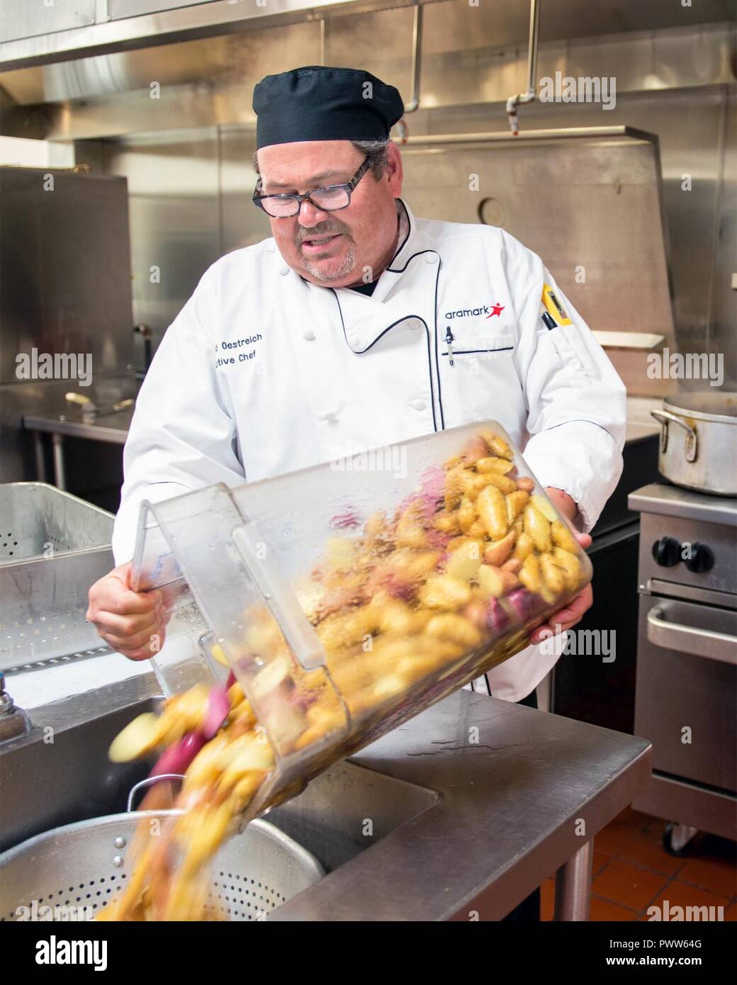 Maynard Oestreich, executive chef for Aramark prepares meals prior to ...