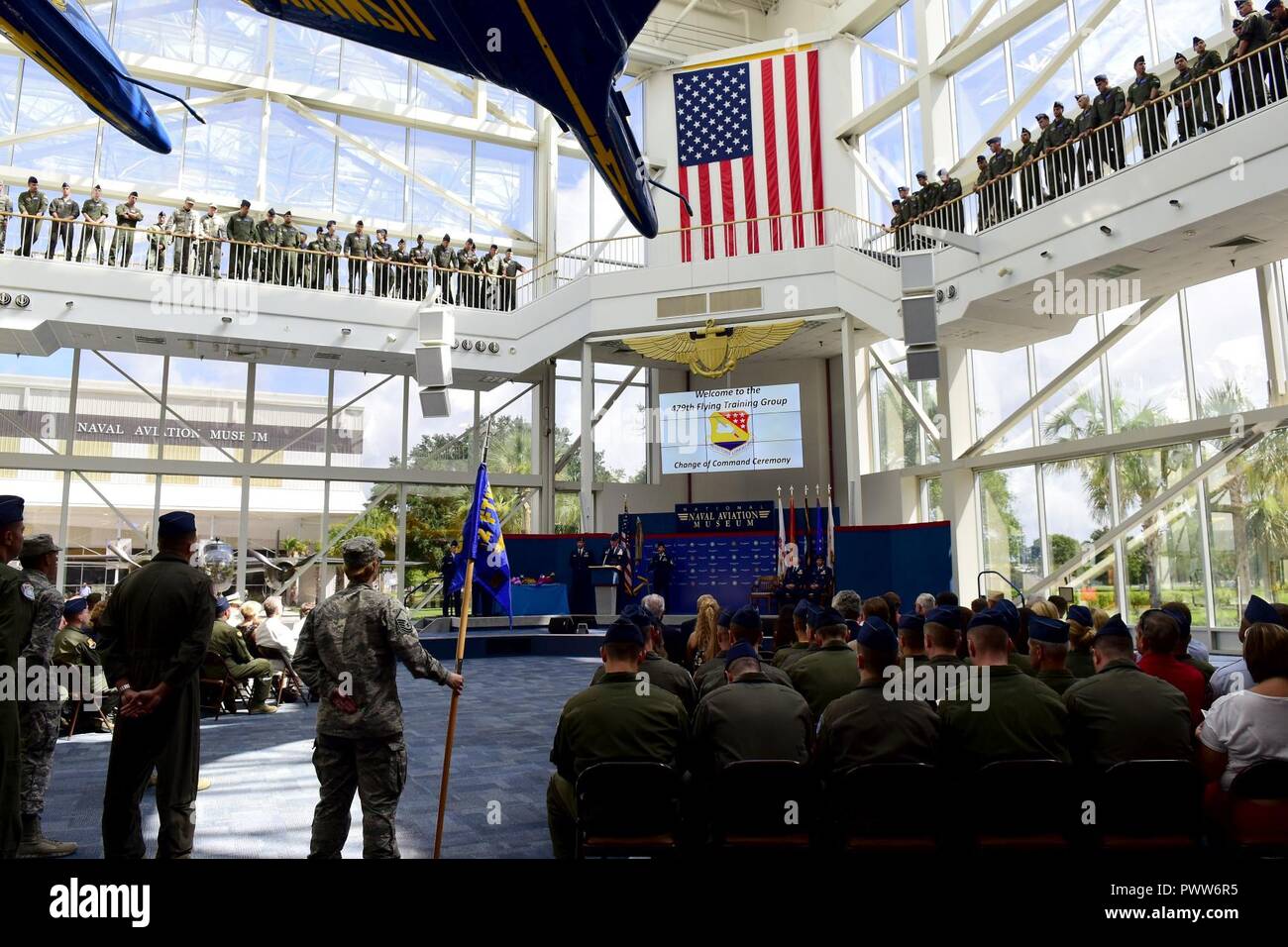 Members of the 479th Flying Training Group look on during a change of ...