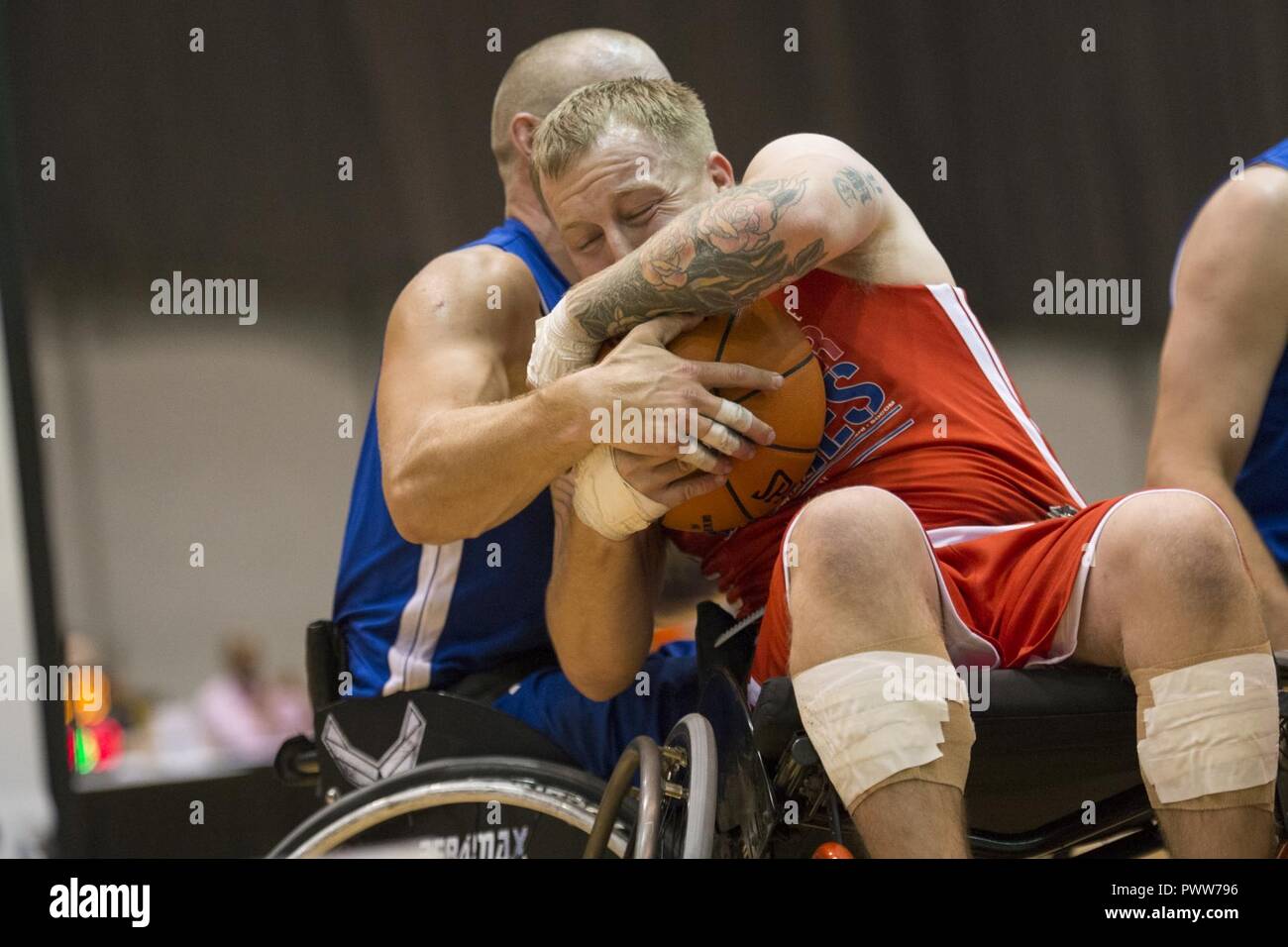 Marine Corps Sgt. Jacob Greenlief battles for the ball with Air Force ...