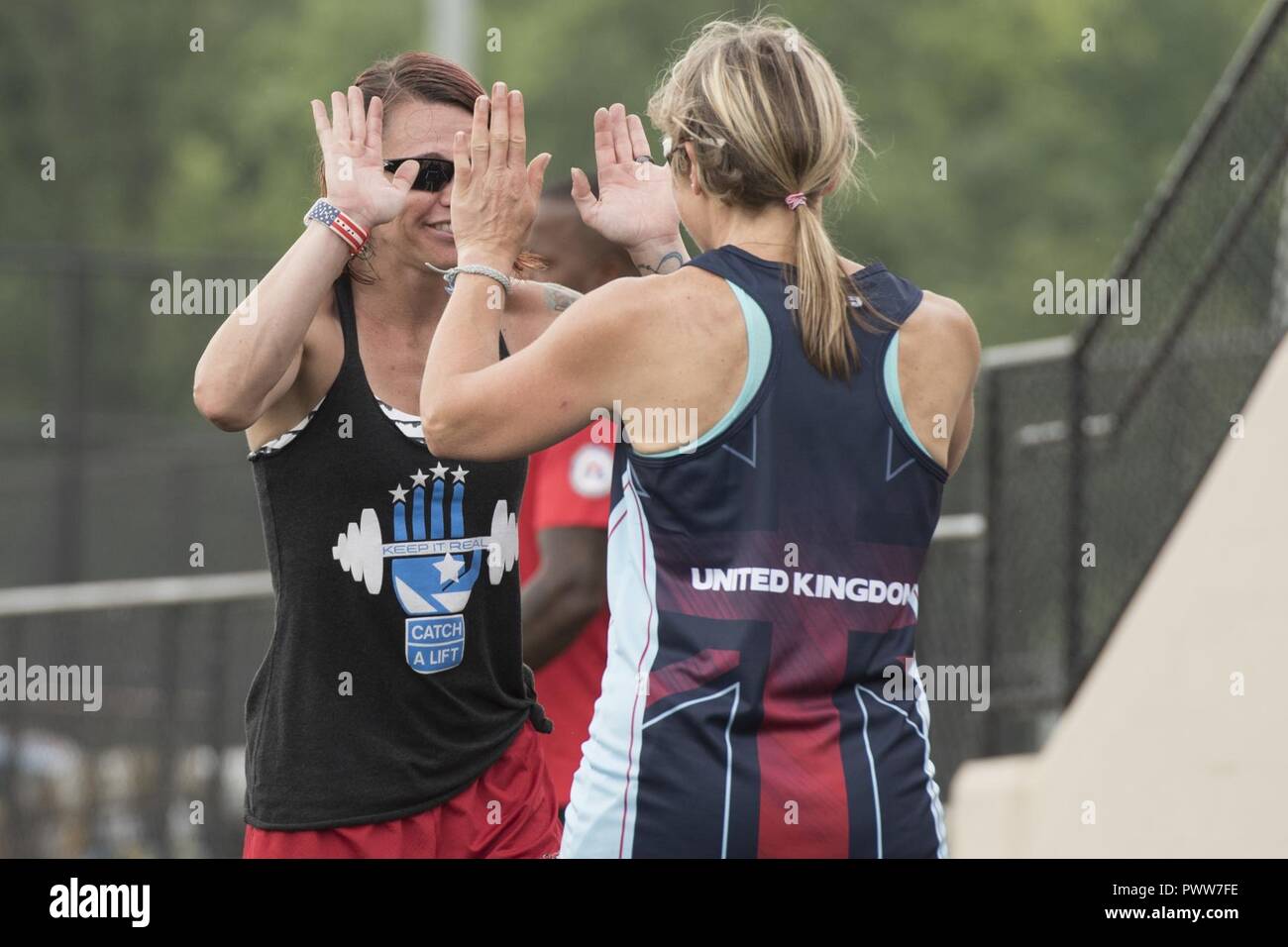 Marine Corps veteran Sarah Rudder, left, high fives Royal Air Force ...