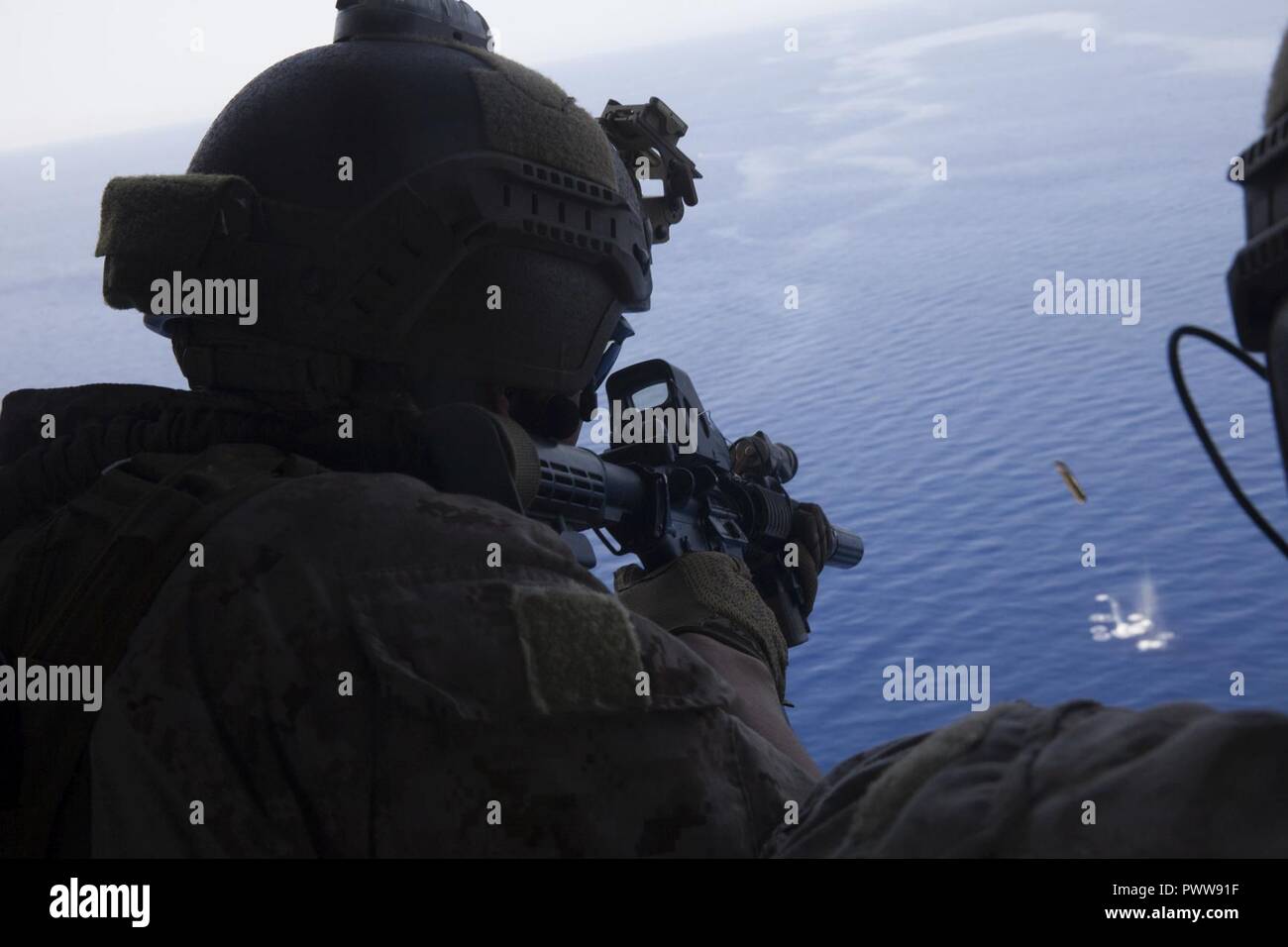 A Marine assigned to the Maritime Raid Force, 24th Marine Expeditionary ...