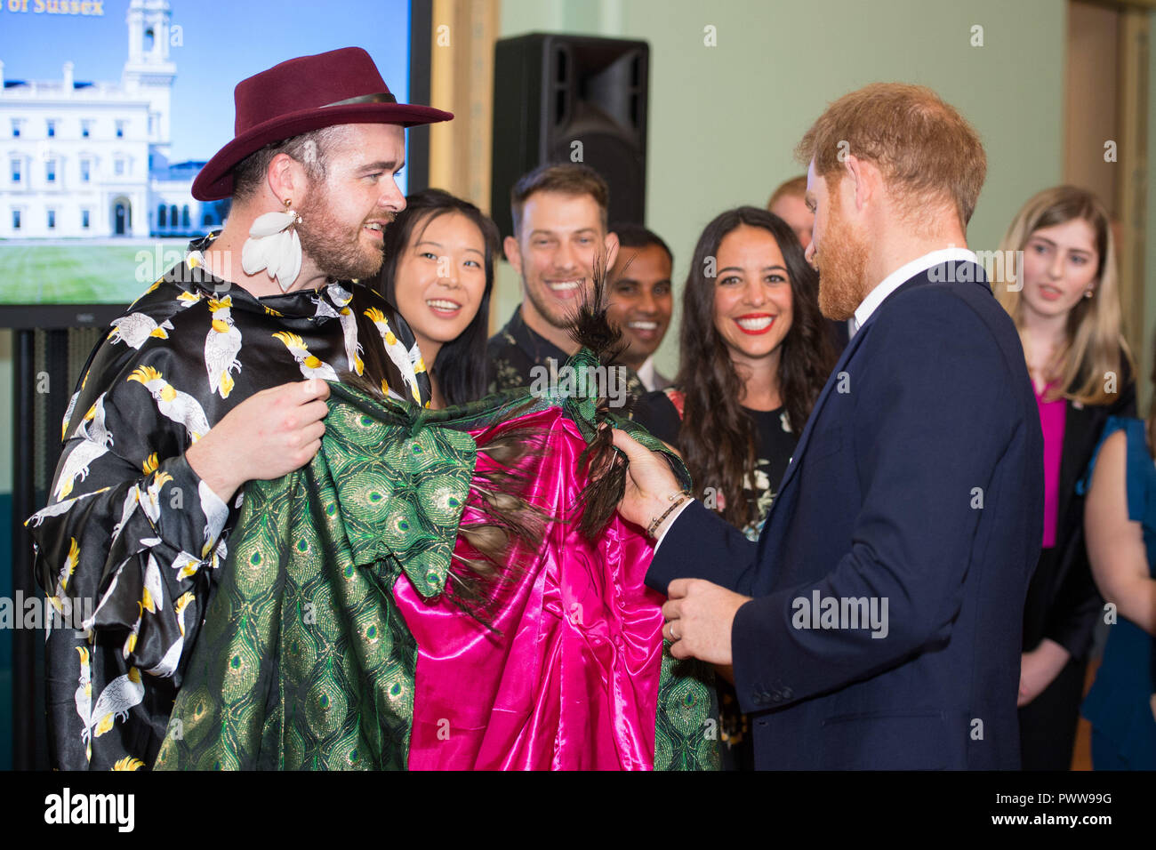 The Duke of Sussex meets Jacob Thomas (left) at a reception given by ...
