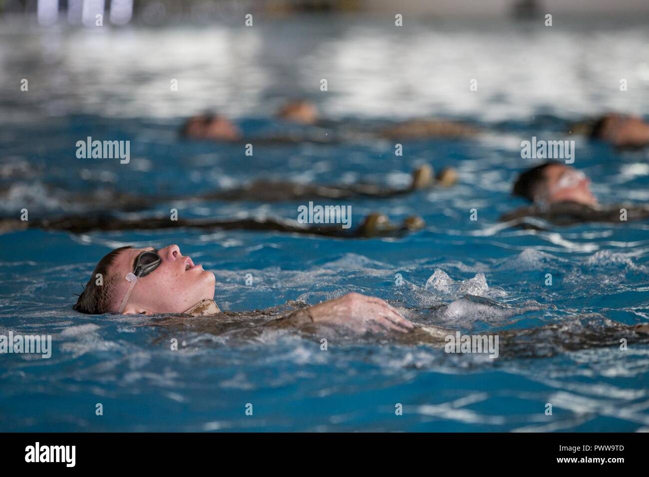 U.S. Marines assigned to the 2nd Marine Aircraft Wing swim laps during ...