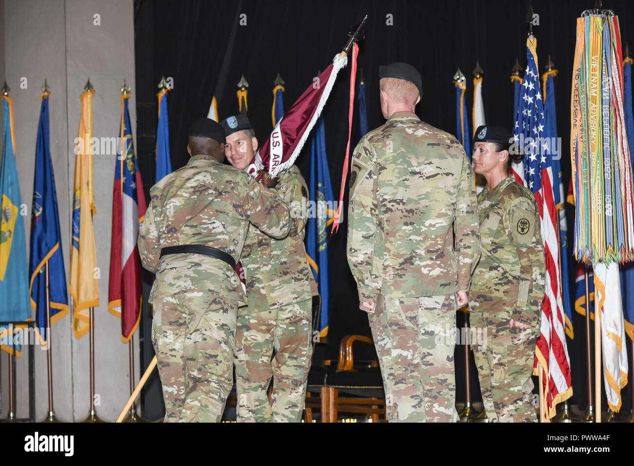 Brigadier General R. Scott Dingle hands the flag to in-coming Colonel ...