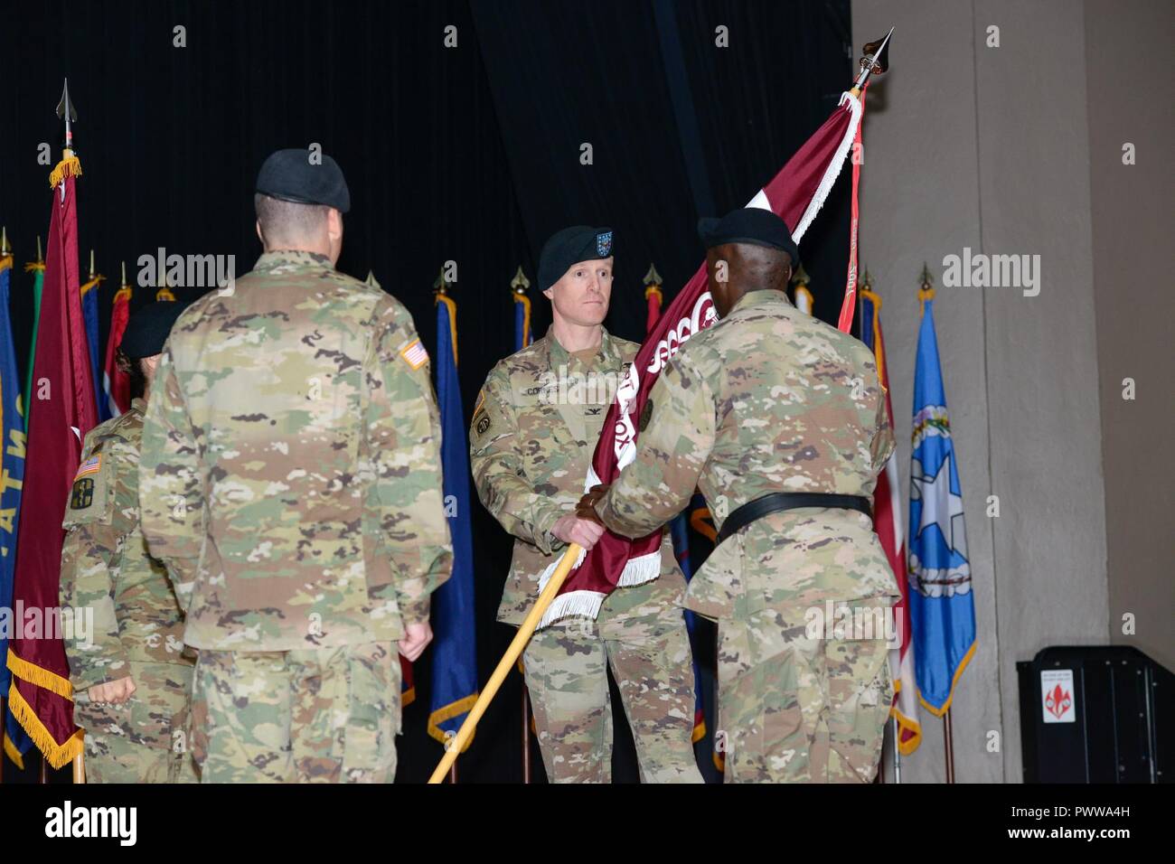 Out-going Colonel Robert Cornes hands the flag to Brigadier General R ...