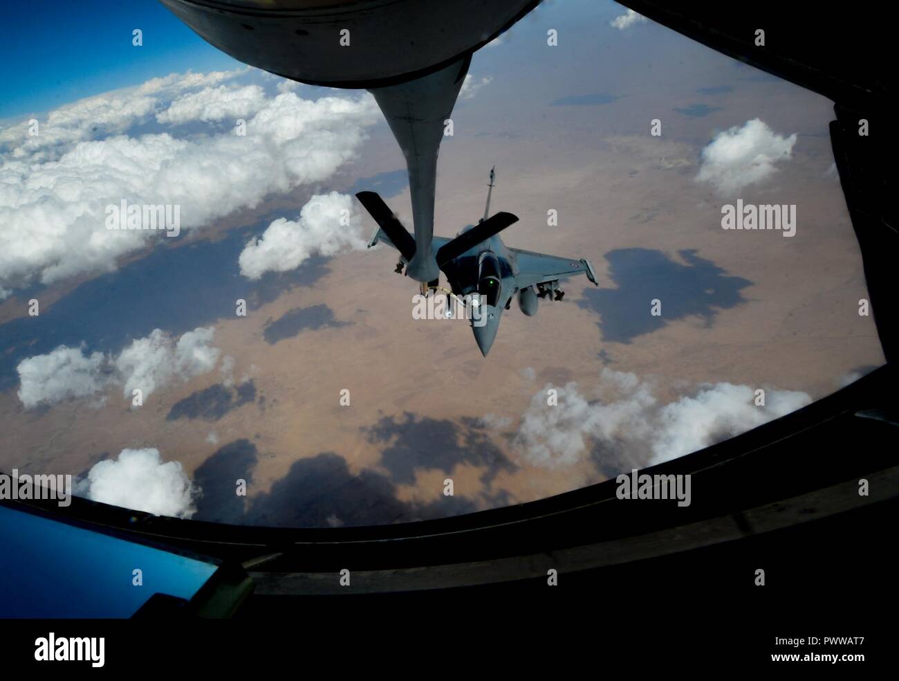 A French air force Rafale receives fuel from a 340th Expeditionary Air ...