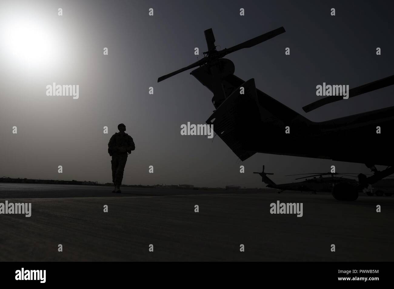 An Airman from the 303rd Expeditionary Rescue Squadron performs a walk ...