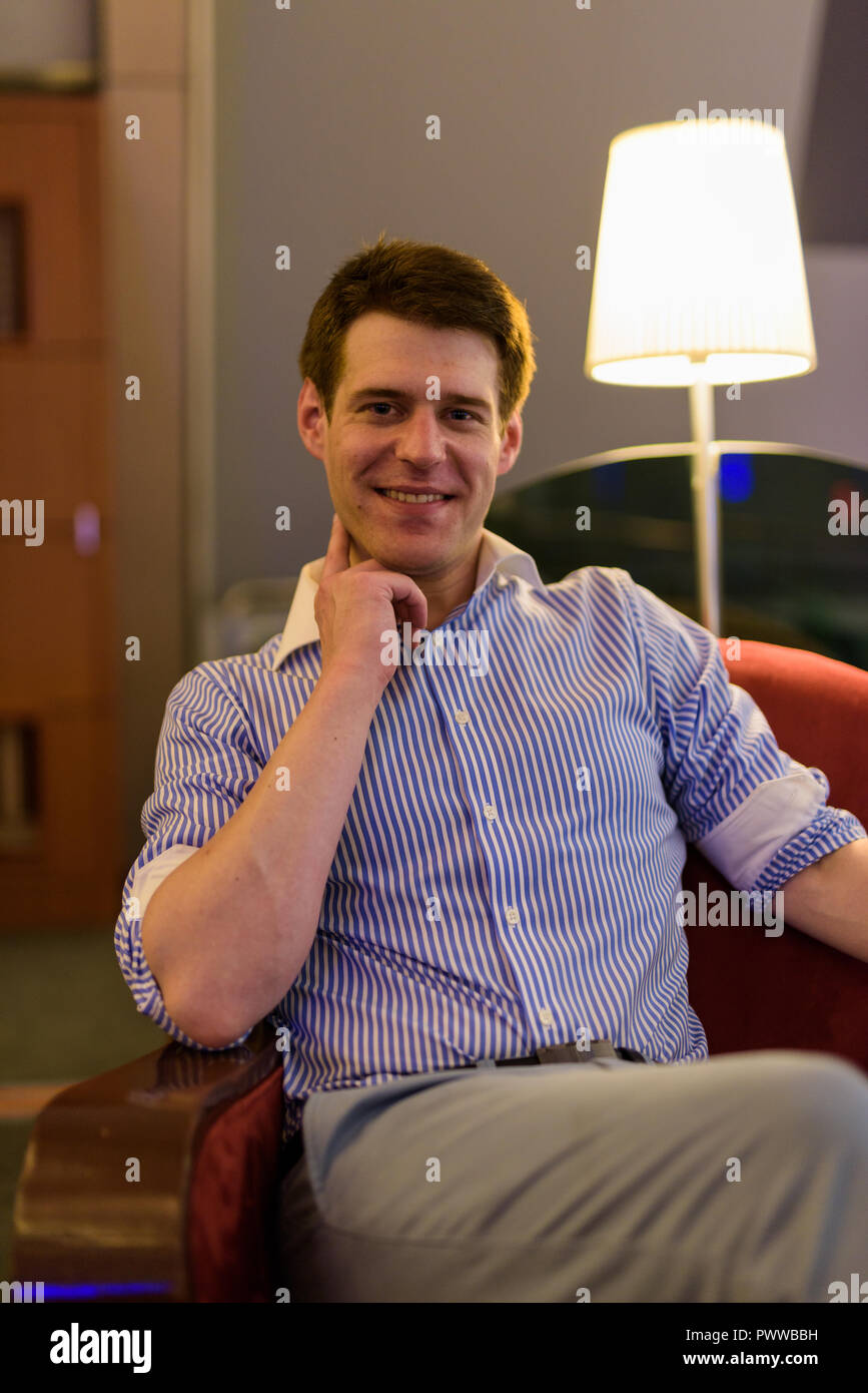 Businessman smiling lobby hi-res stock photography and images - Alamy Businessman smiling lobby hi-res stock photography and images - Alamy