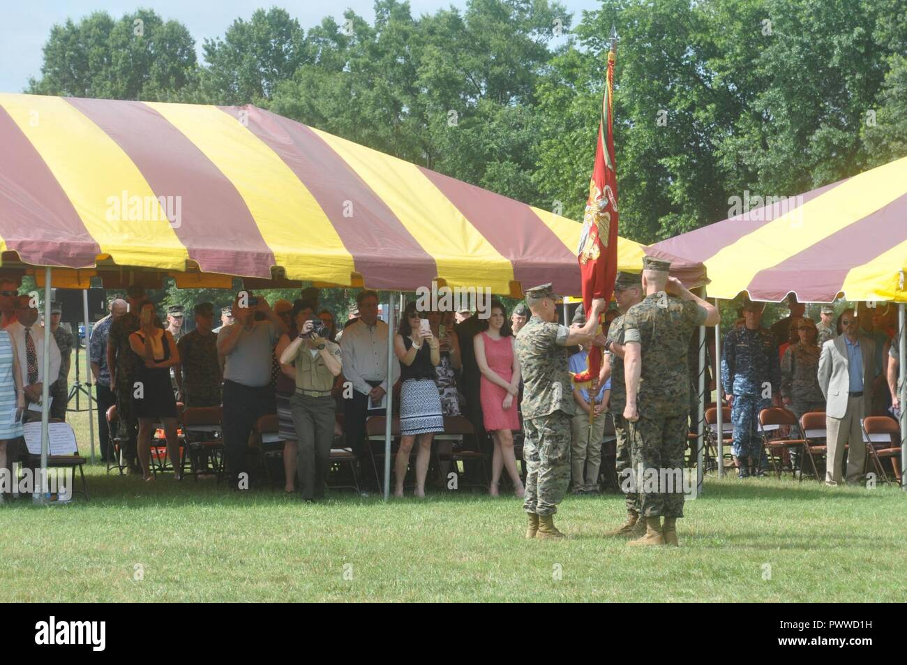 Col. Todd Oneto, H&S Bn. commander passes on the colors to Col. John ...
