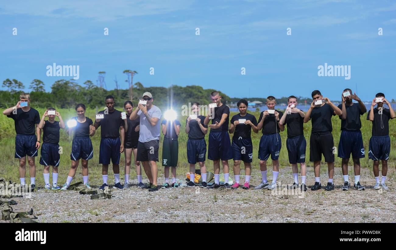 Junior ROTC cadets practice mirror signaling during survival, evasion ...