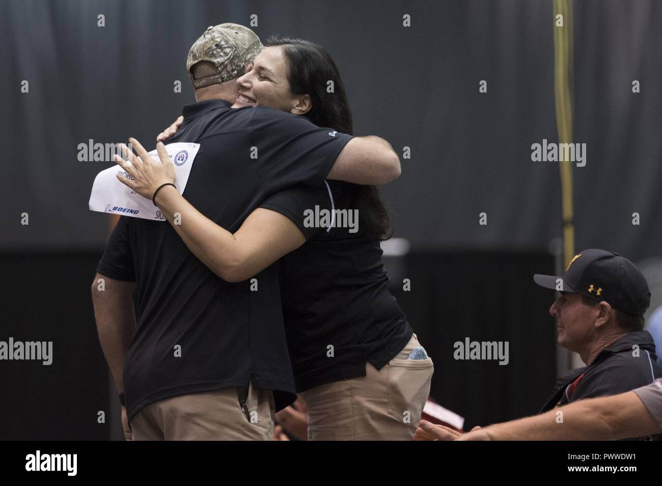 Army veteran Robert Roberts hugs his coach Navy veteran Laura Root, who ...