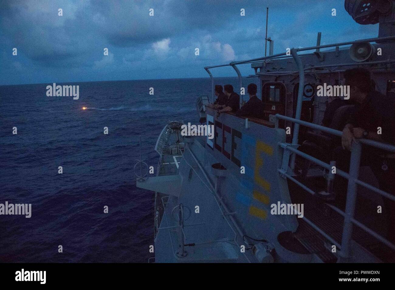 WATERS OFF GUAM (June 28, 2017) Sailors observe a marking flare during ...