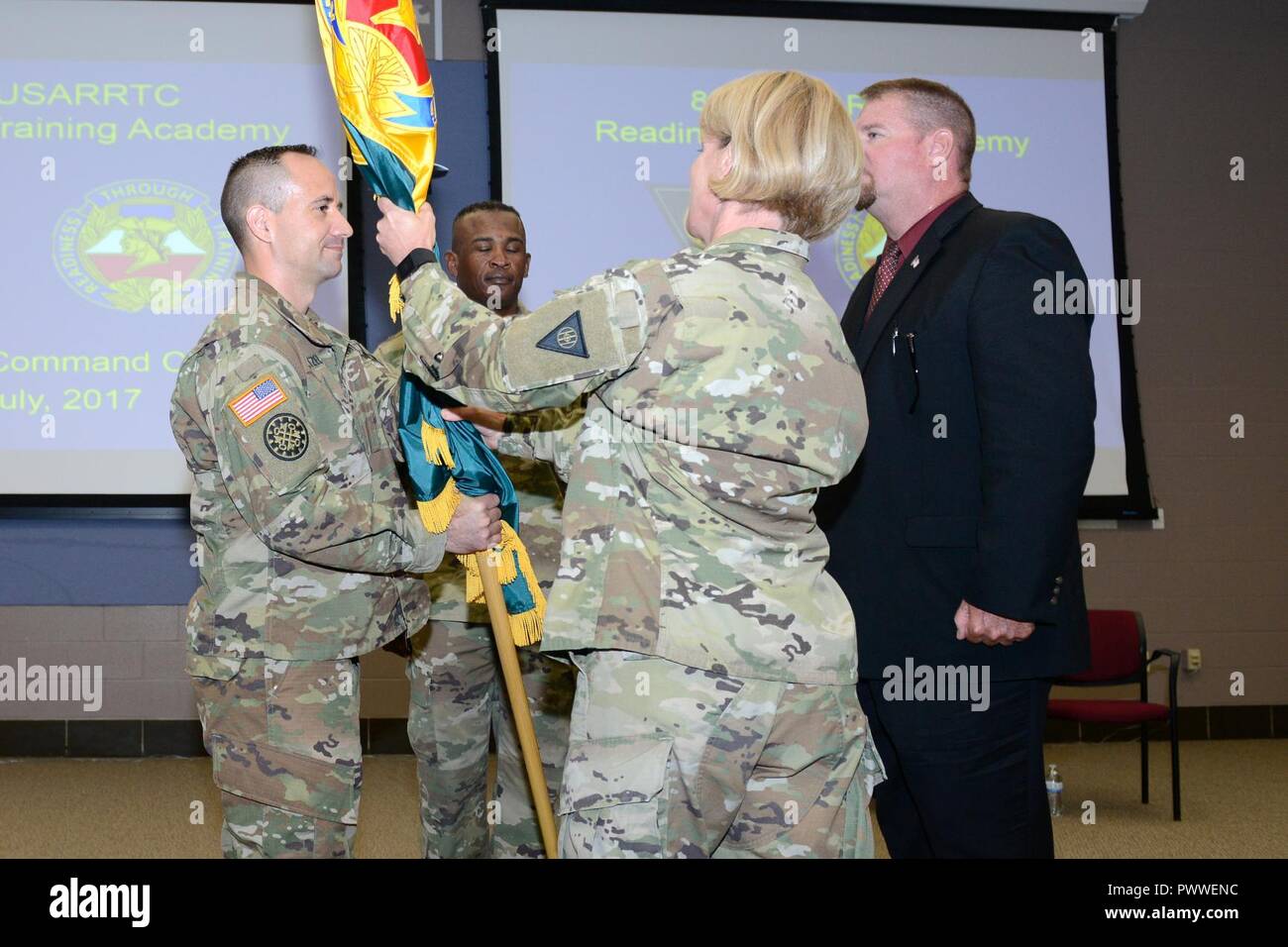 COL Kathleen Porter hands the battalion flag to incoming RTA Commandant ...