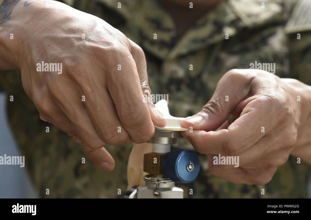 U.S. Navy Senior Chief Petty Officer Ruel Lacno, assigned to the ...
