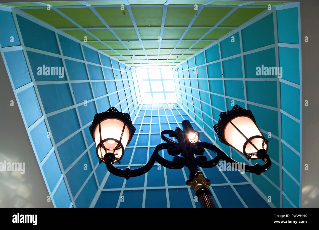 Abstract perspective of vertical lobby ceiling with skylight, vintage ...