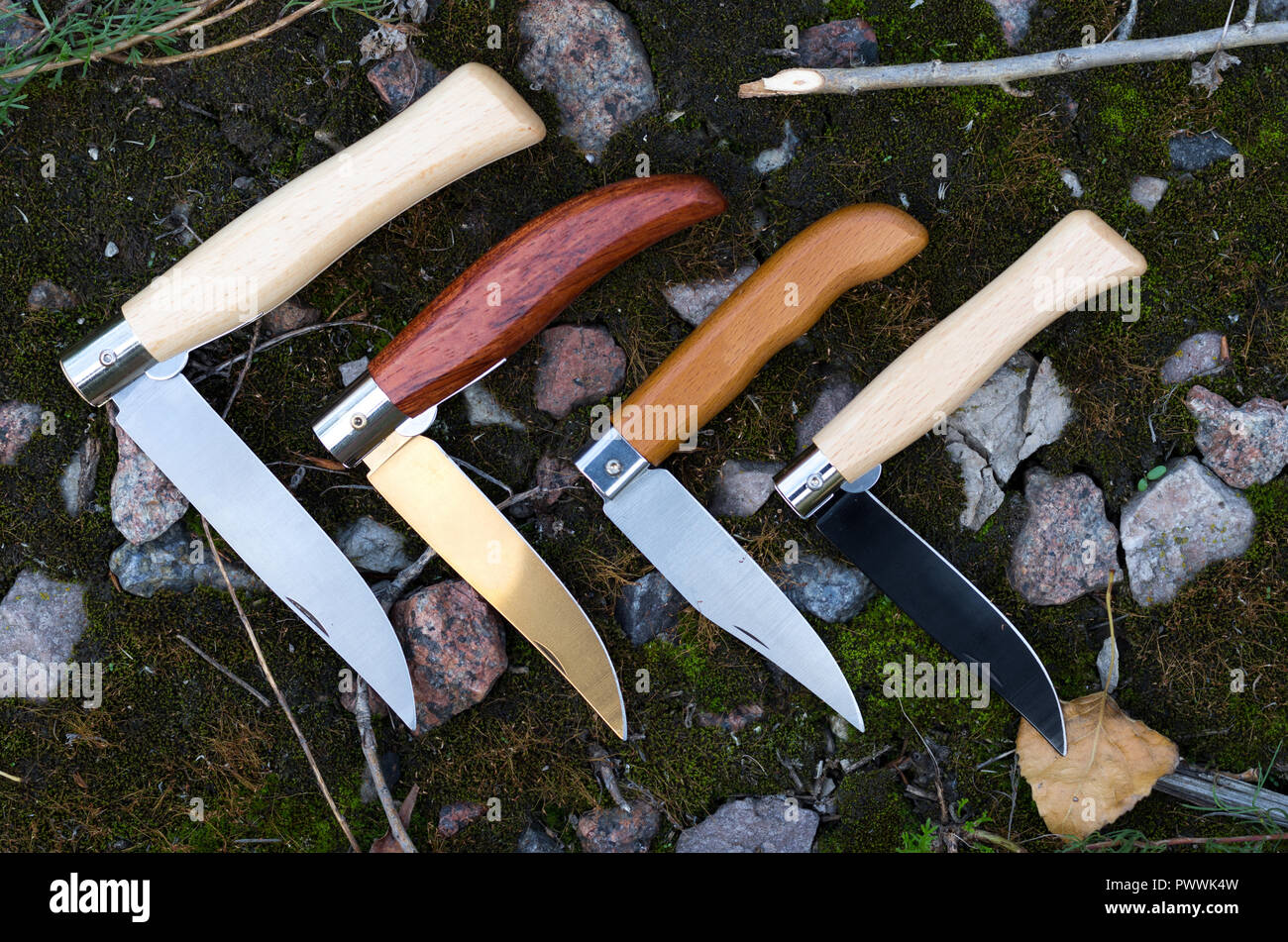 Knife with a wooden handle. Pocket knives. Many knives. Top view Stock ...
