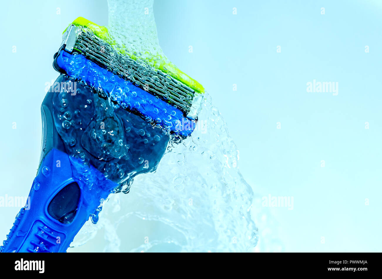 Razor close-up with water splash Stock Photo - Alamy